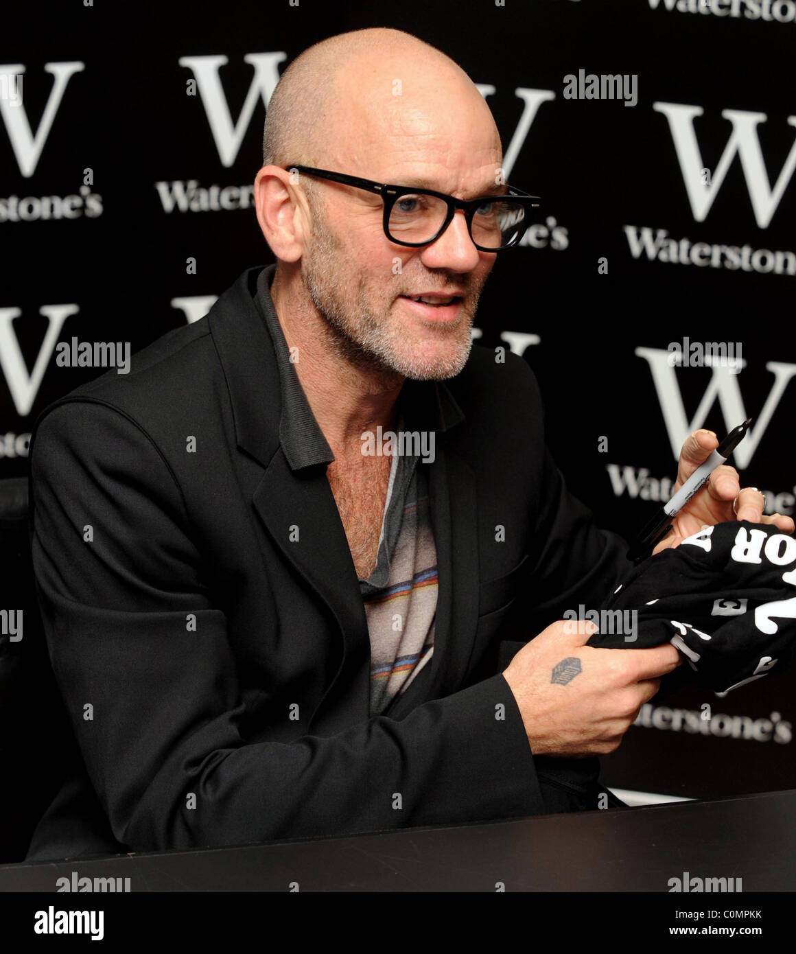 Michael Stipe of R.E.M signing their new book 'Hello' at Waterstone's ...