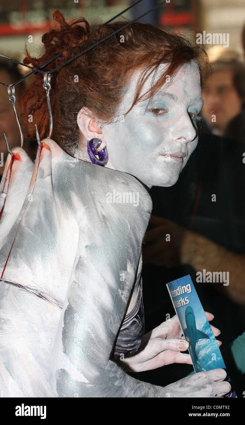 Alice Newstead A performance artist has been hung from de-barbed hooks ...