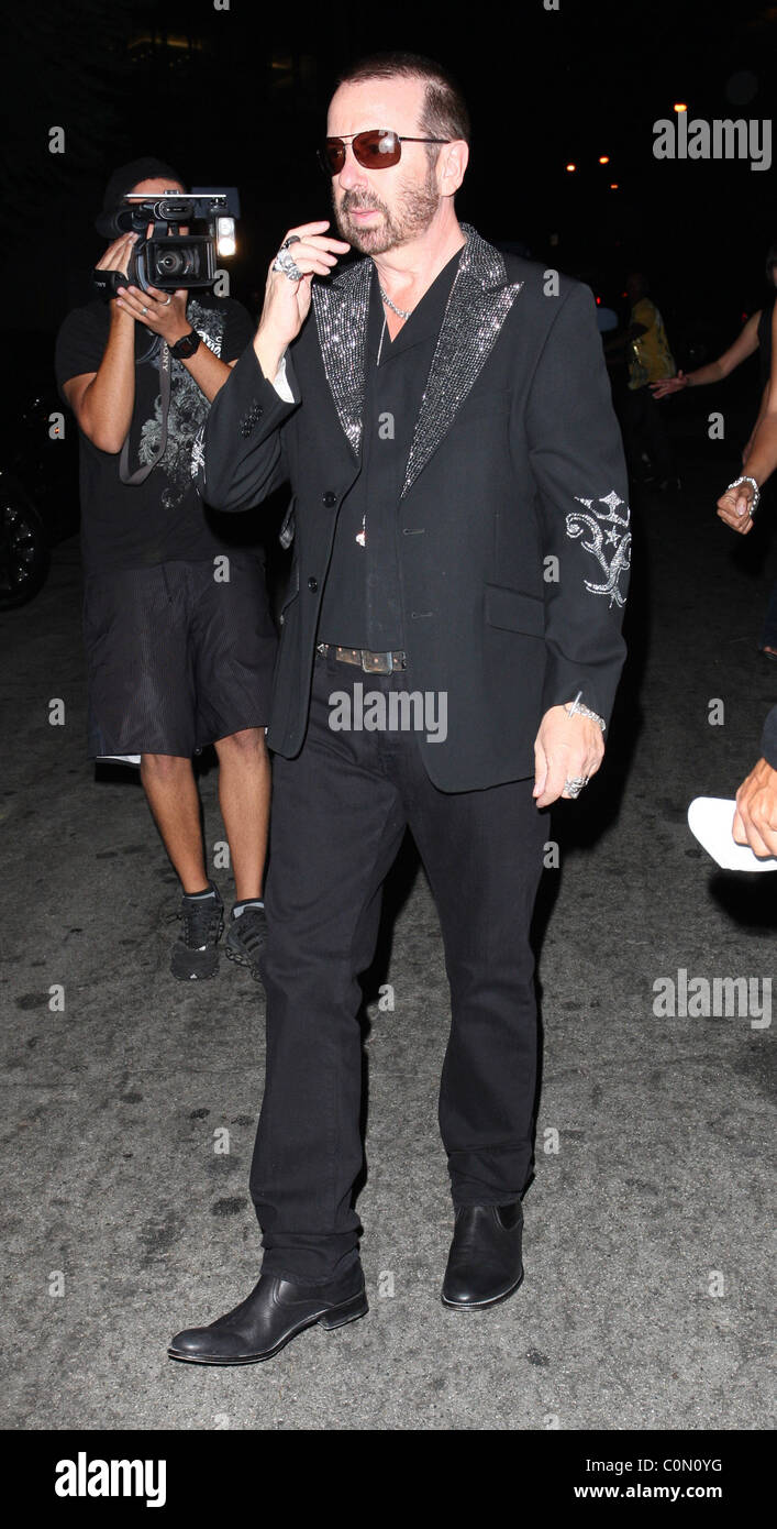 Dave Stewart leaves the Sunset Marquee Hotel under police escort ...