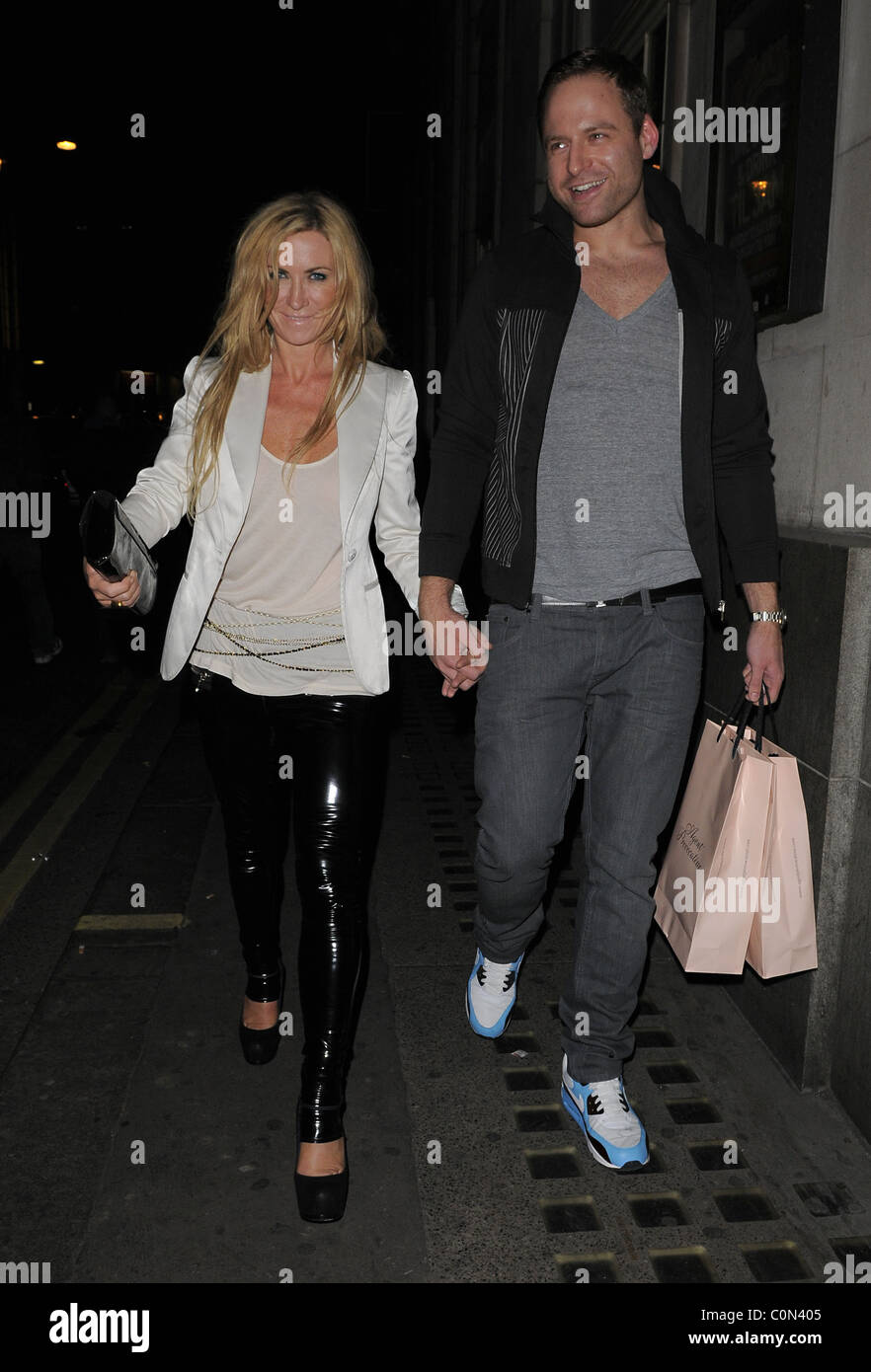 Meg Matthews and a mystery man leaving the Agent Provocateur party ...
