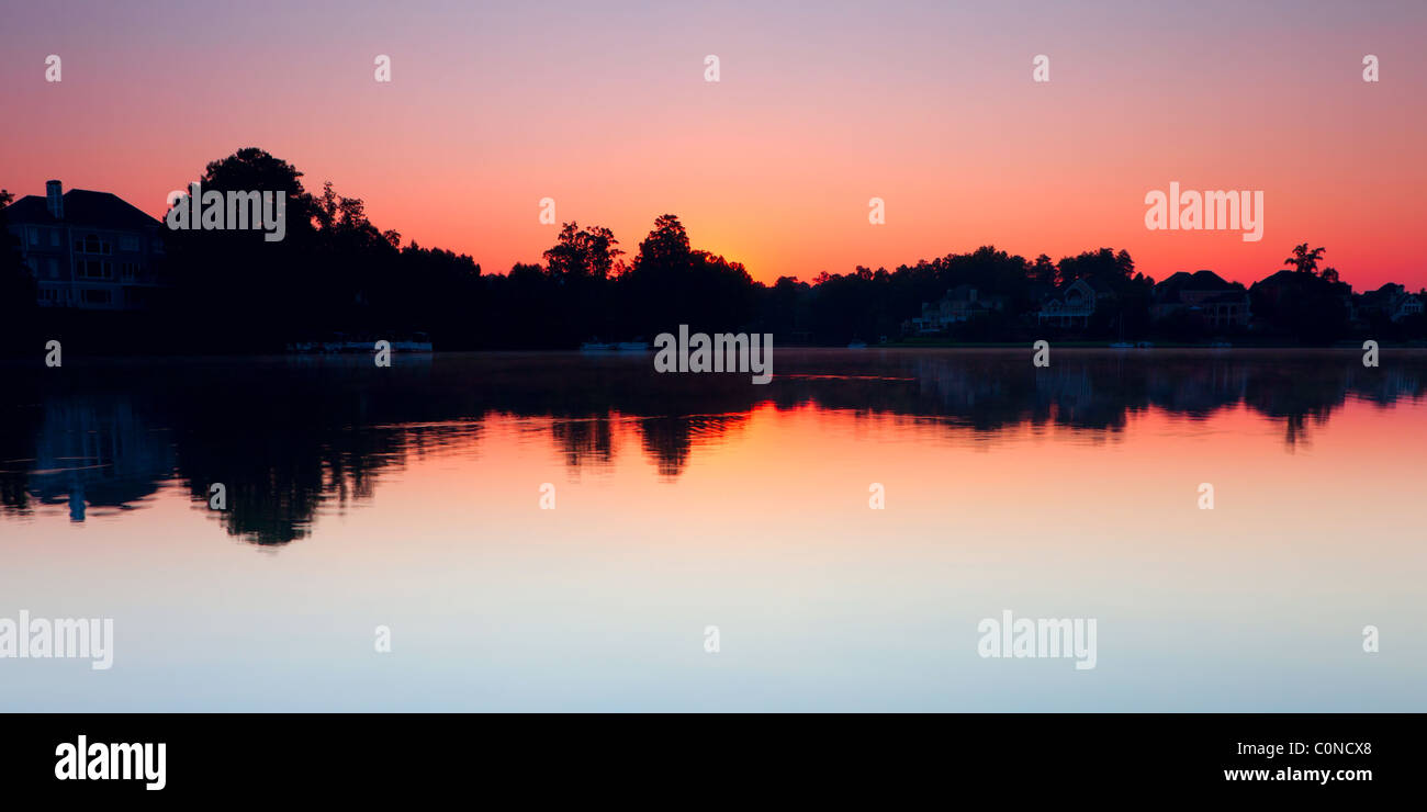 panoramic countryside view of lake and houses during sunrise Stock ...
