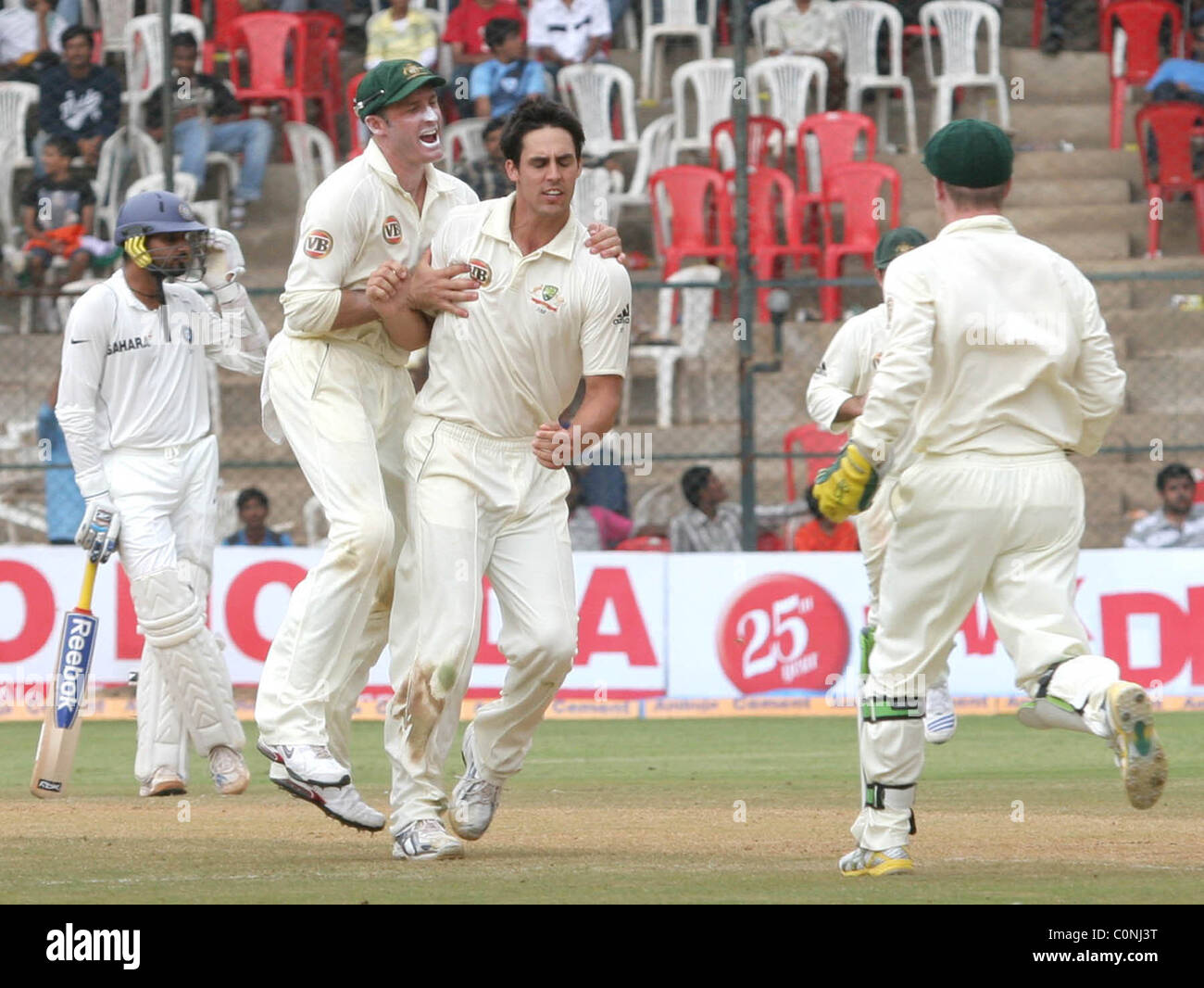 Australian Cricketer Mitchell Jonson with his teammates celebrating the ...