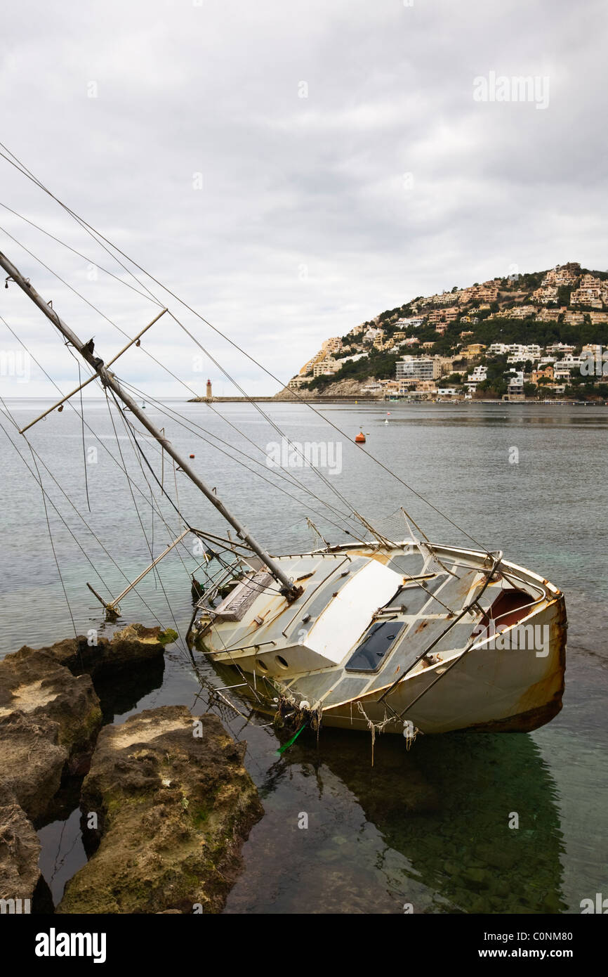 Abandoned shipwreck off the coast of Majorca, tourist resort on ...