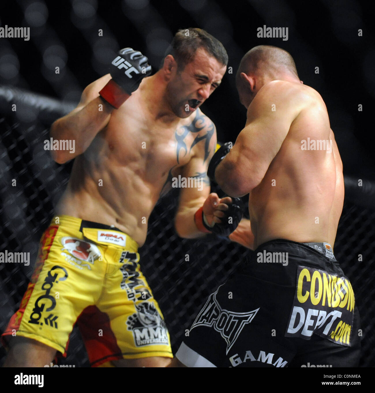 Fighter Paul Taylor of Walsall England in the yellow shorts lost his ...