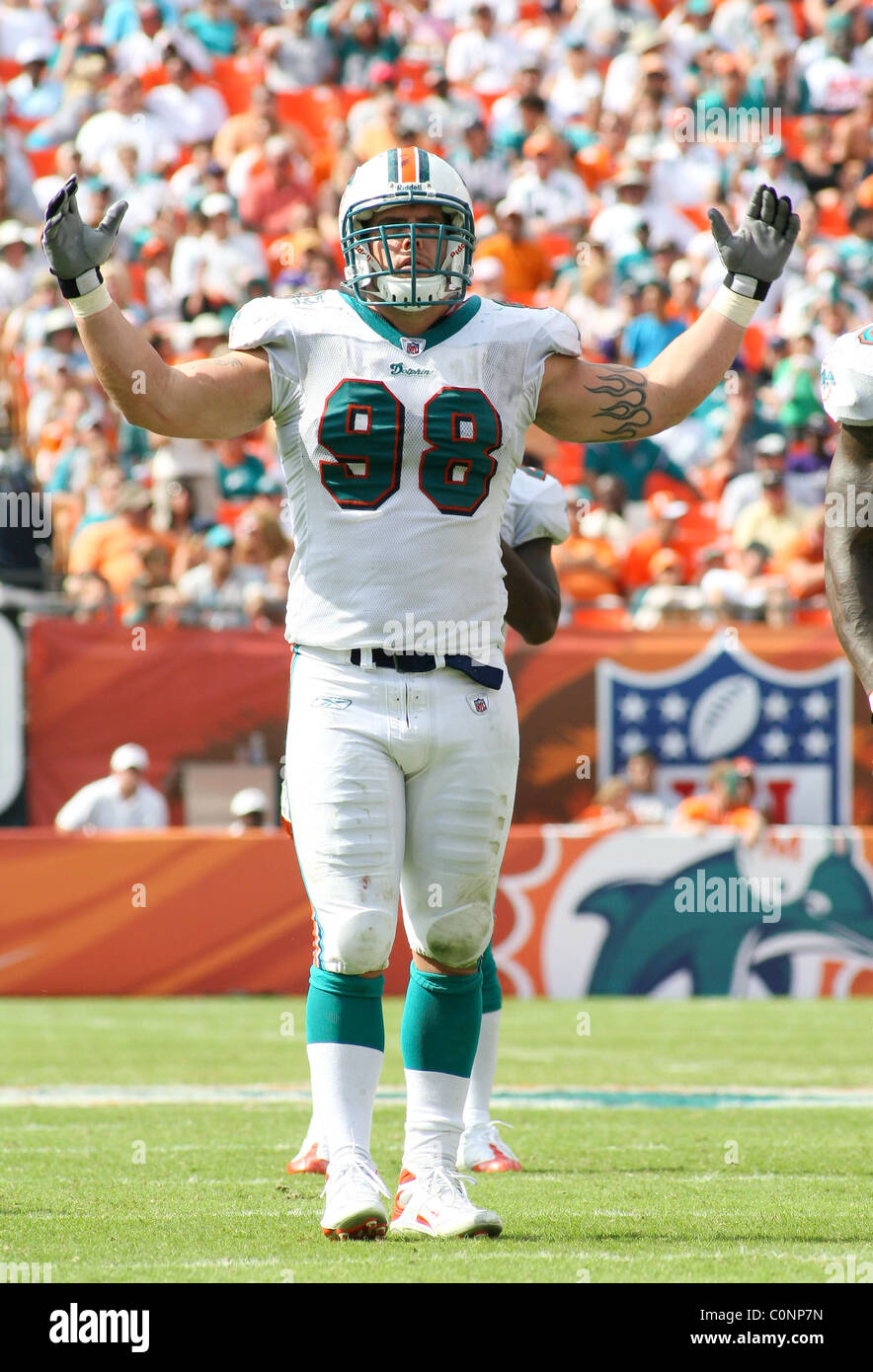 Matt Roth of the Miami Dolphins attempts to pump up the crowd as the ...