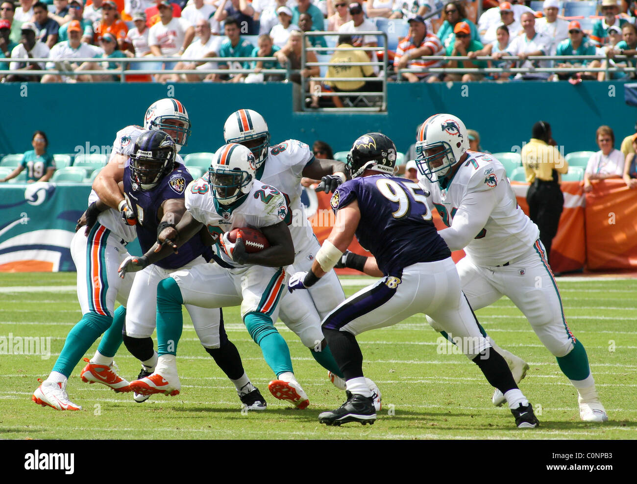 Ronnie Brown of the Miami Dolphins with the ball as the Baltimore ...