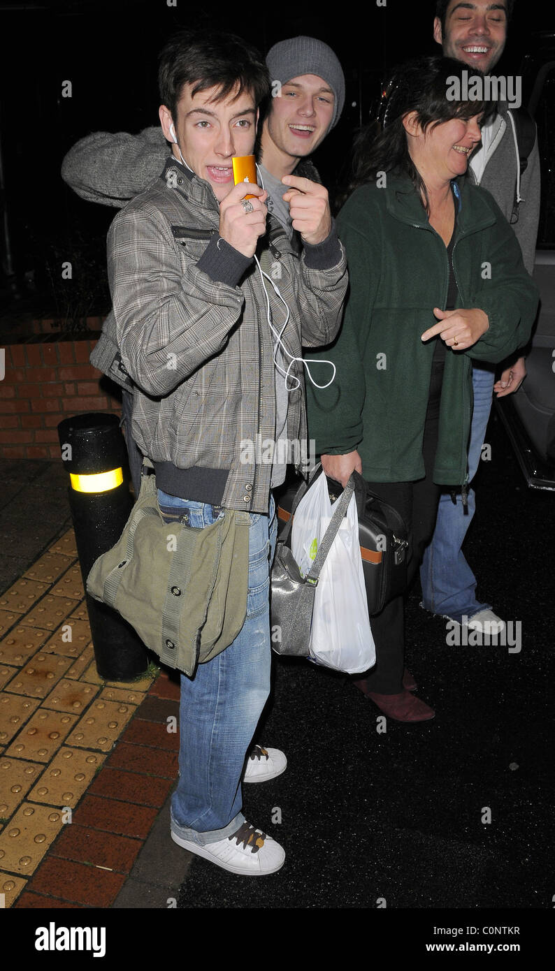 Scott Bruton and Austin Drage mess around with their mp3 players as ...