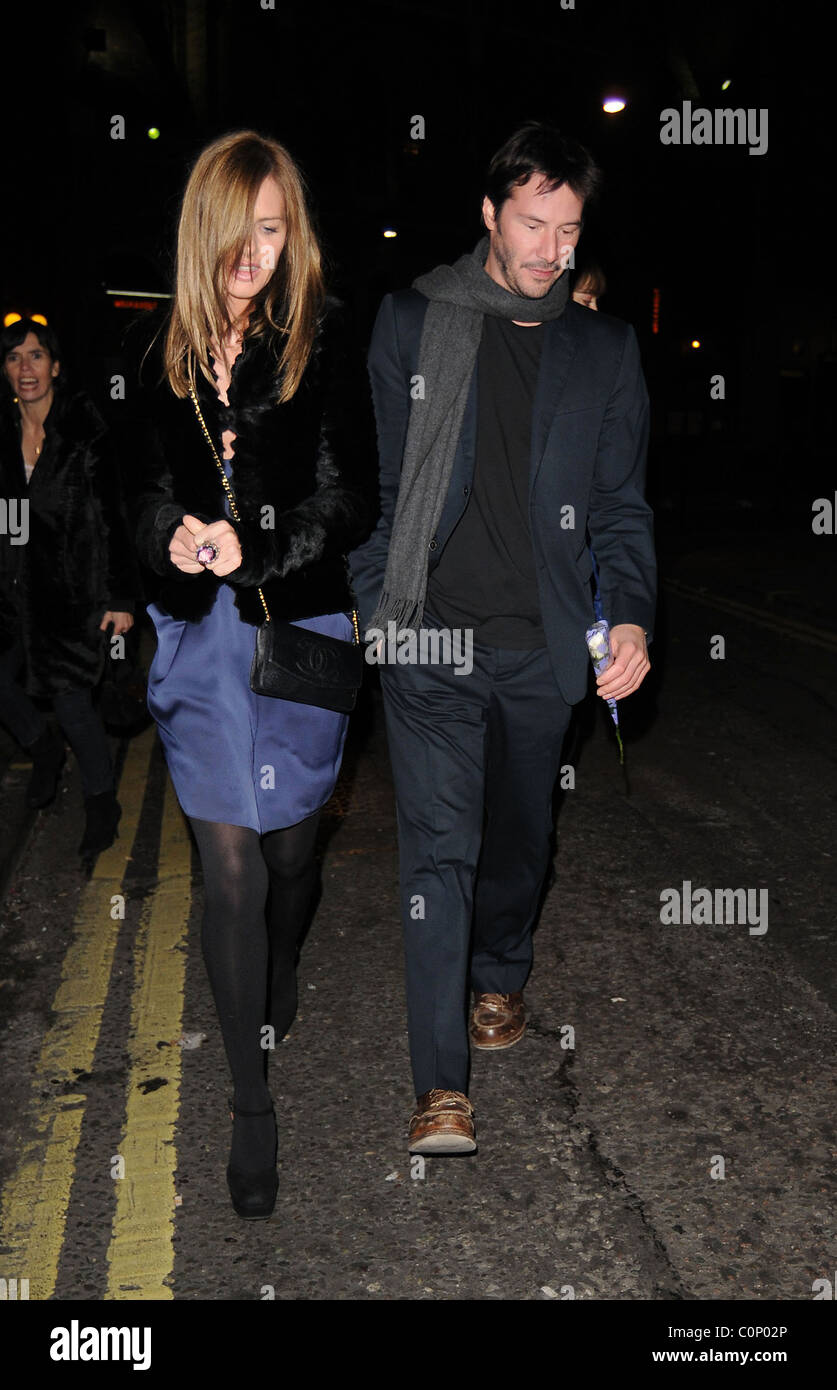 Keanu Reeves holding a single white rose arrives at the Ivy with Trinny ...