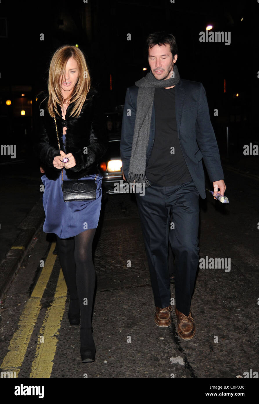 Keanu Reeves holding a single white rose arrives at the Ivy with Trinny ...