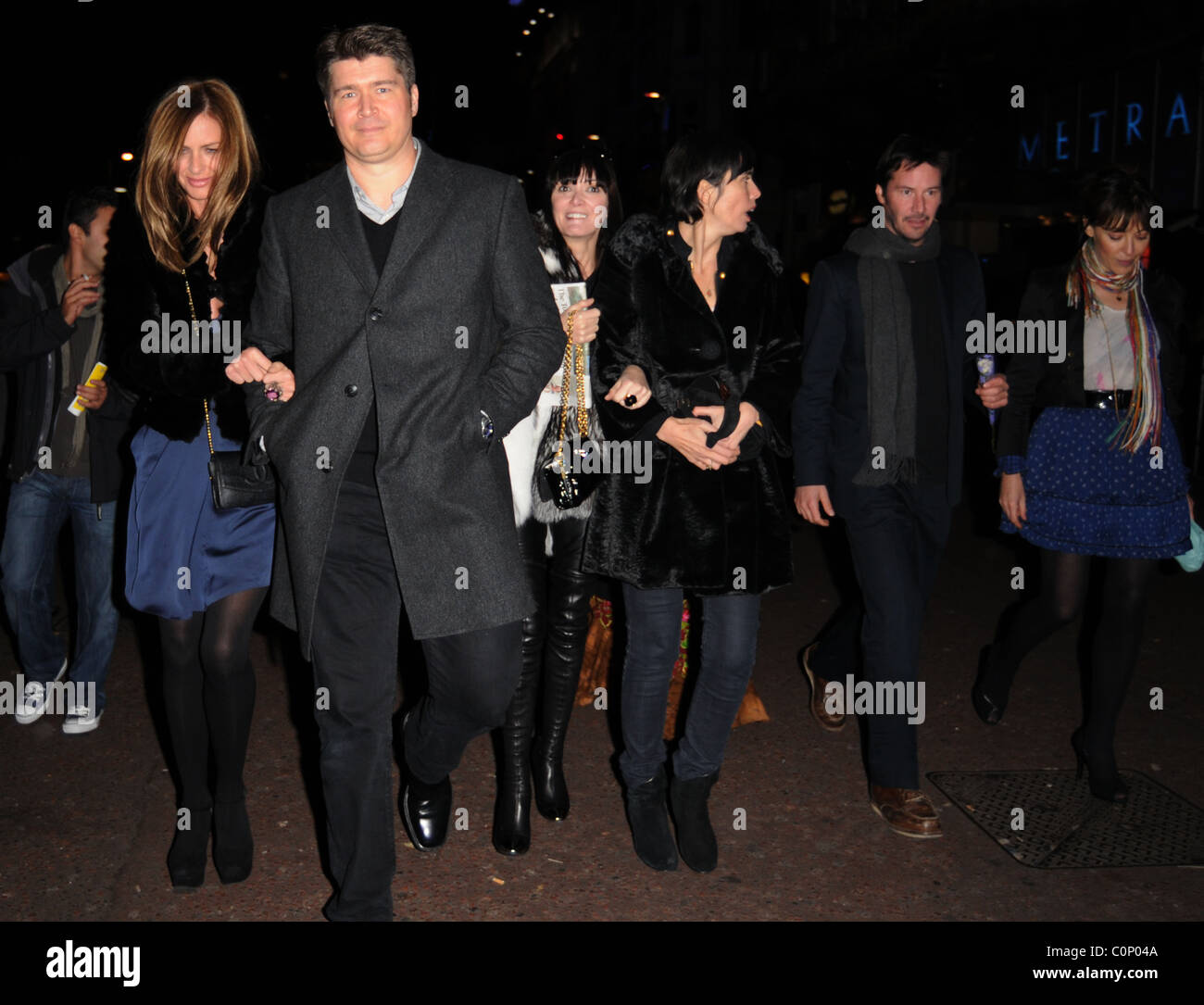 Keanu Reeves holding a single white rose leaves the Empire Casino with ...