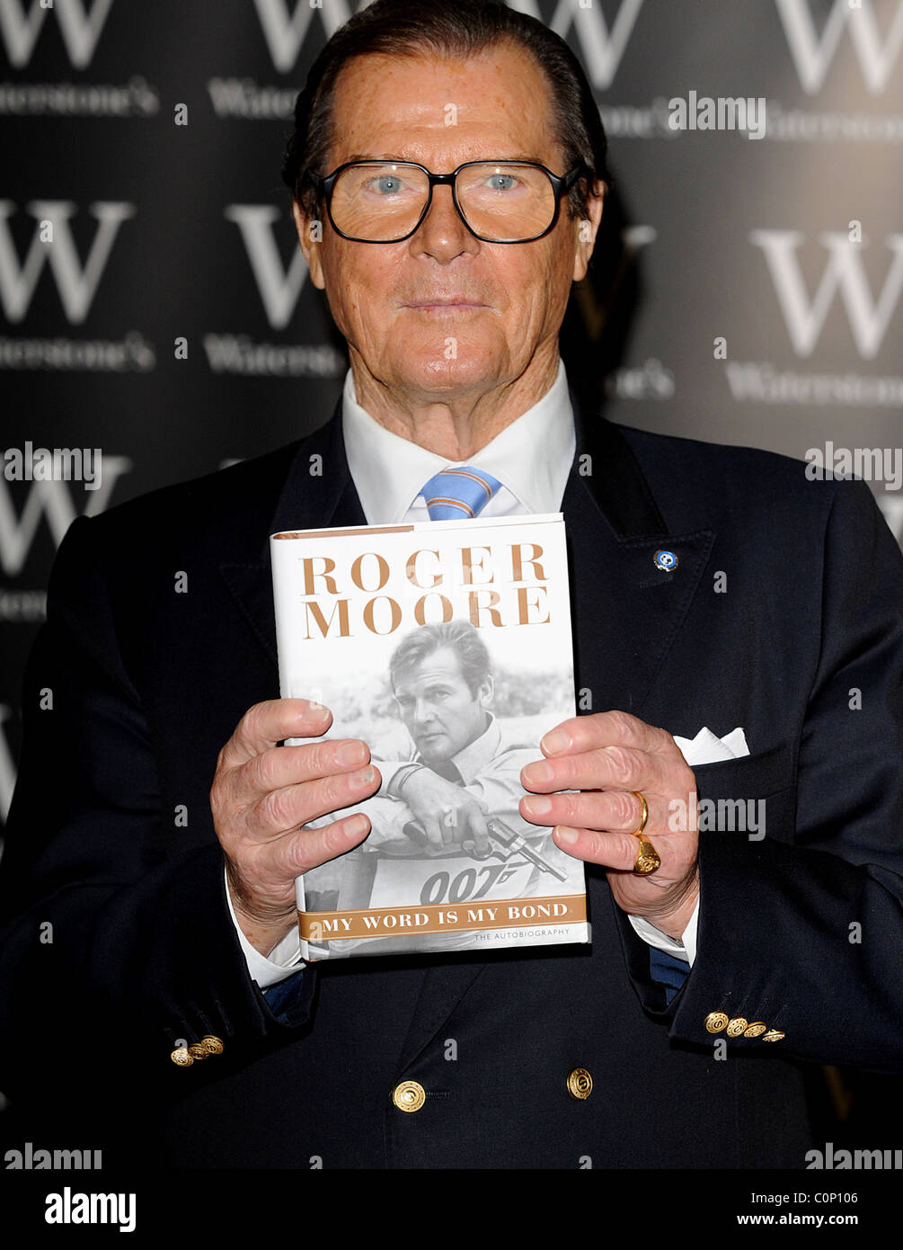 Roger Moore signs copies of his book 'Roger Moore: My Word is My Bond ...