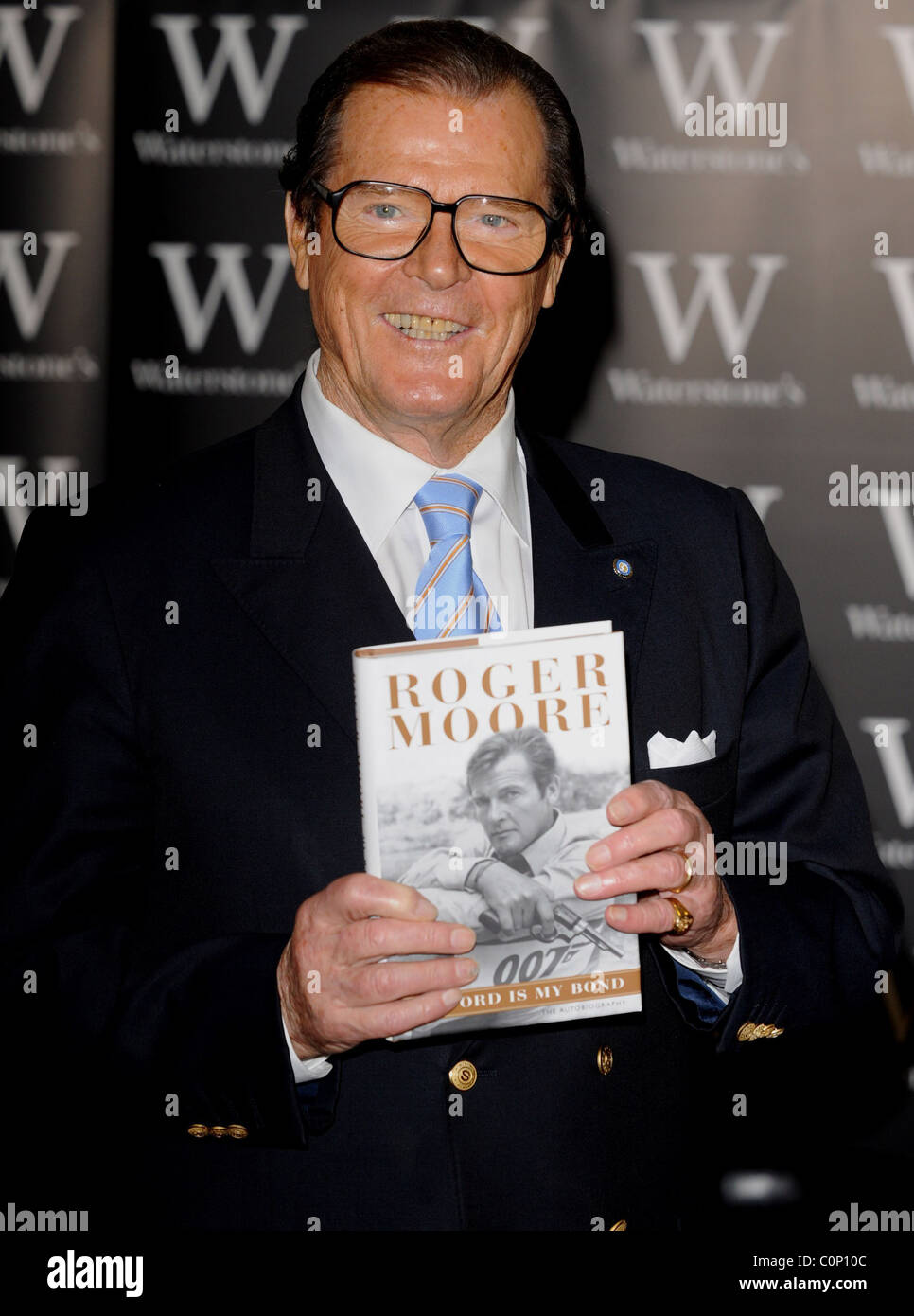 Roger Moore signs copies of his book 'Roger Moore: My Word is My Bond ...