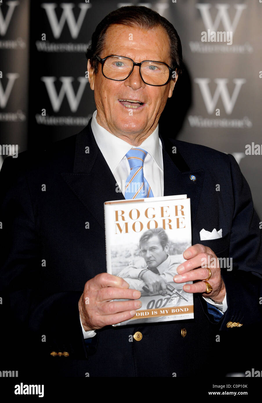 Roger Moore signs copies of his book 'Roger Moore: My Word is My Bond ...