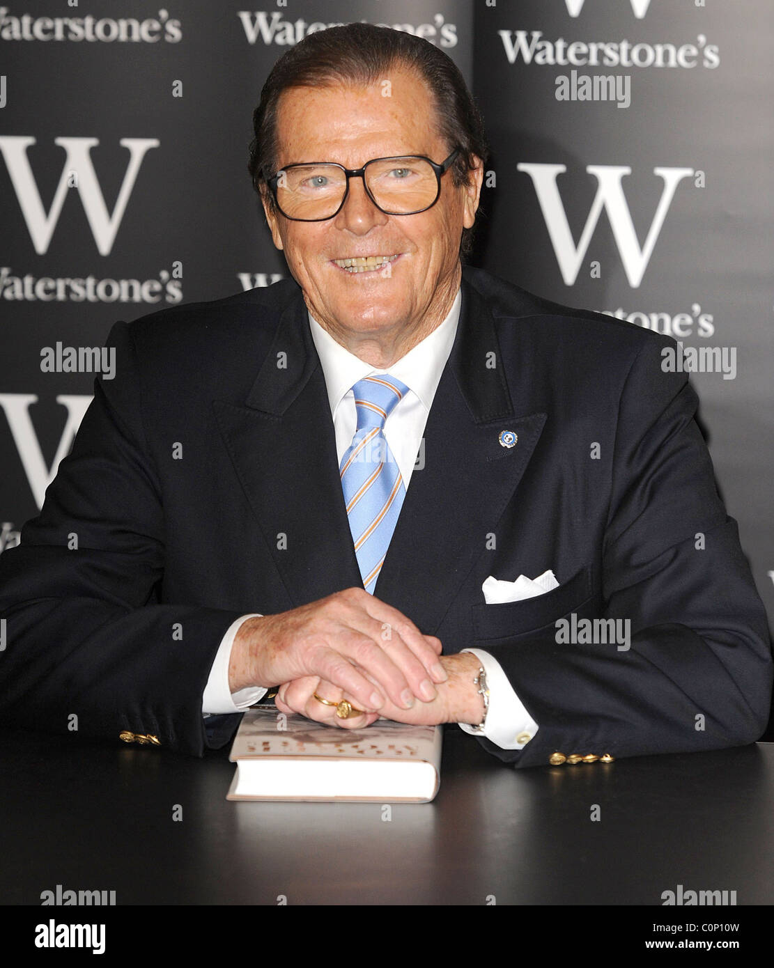 Roger Moore signs copies of his book 'Roger Moore: My Word is My Bond ...