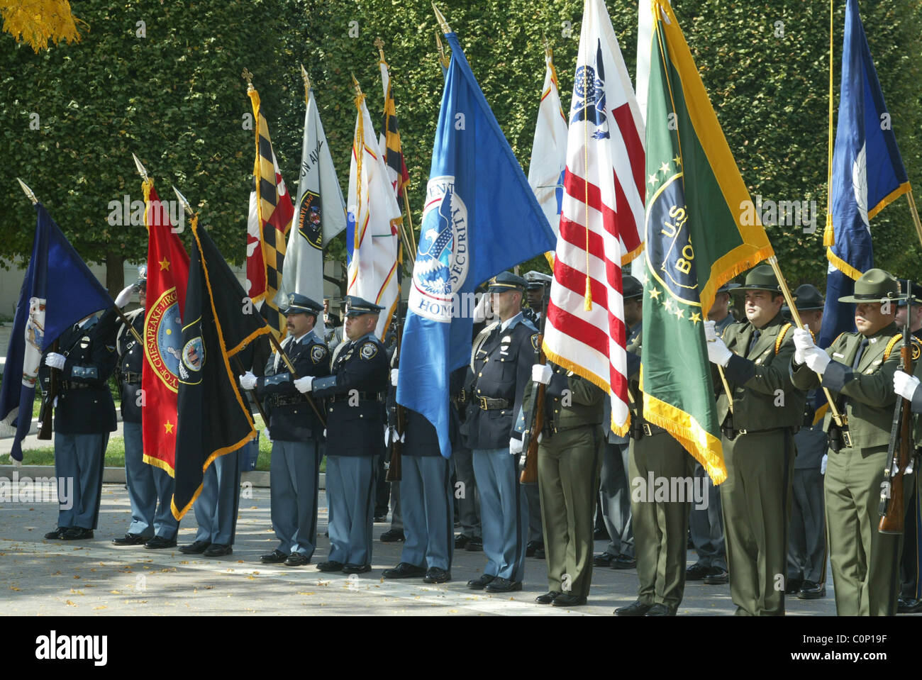 The bereaved hold their rose before placing on the National Law ...