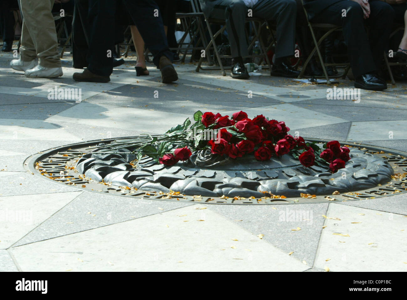The bereaved hold their rose before placing on the National Law ...