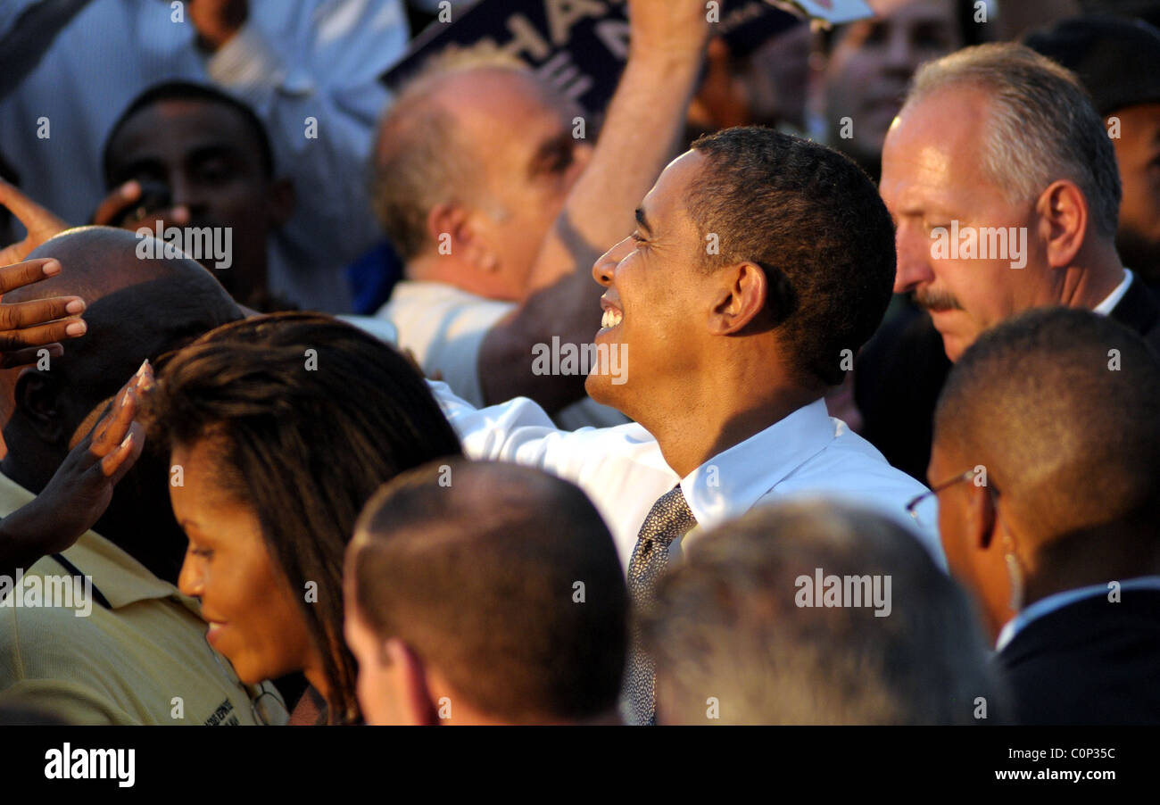 Presidential candidate Barack Obama shakes hands with supporters at a ...