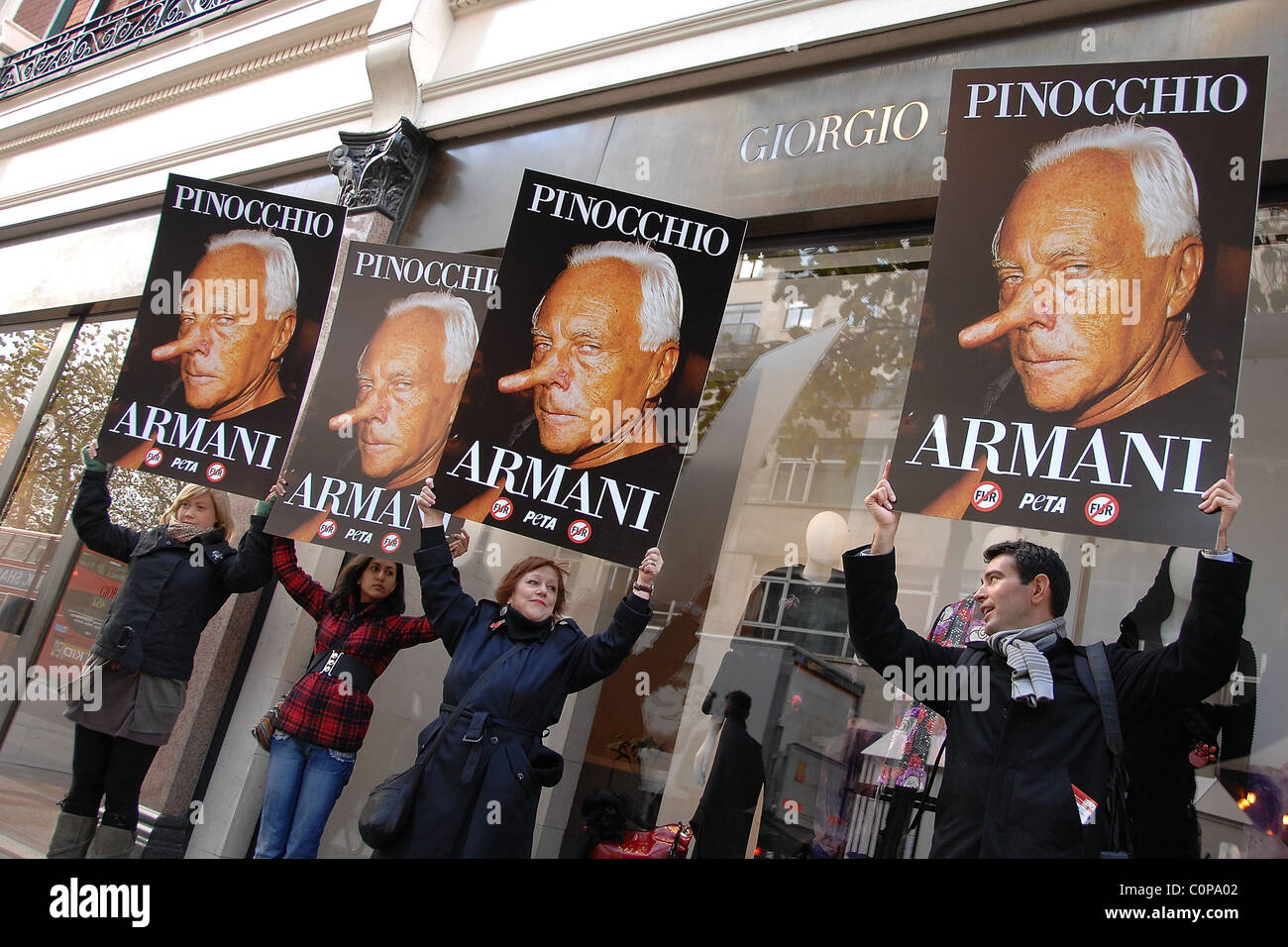 Members of PETA stand outside Giorgio Armani store on Sloane Street as ...