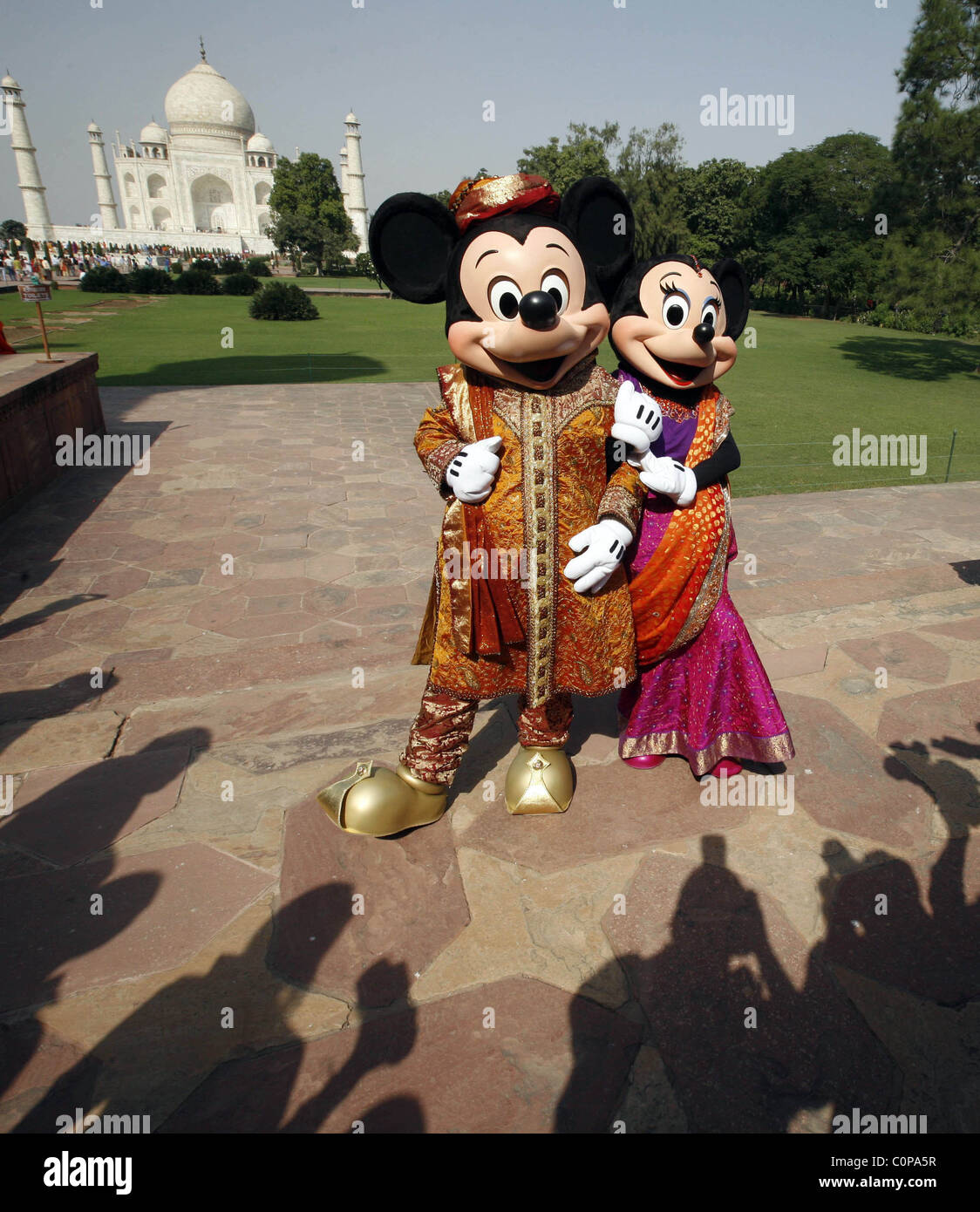Mickey Mouse and Minnie Mouse pose at the Taj Mahal in Agra, India. The ...