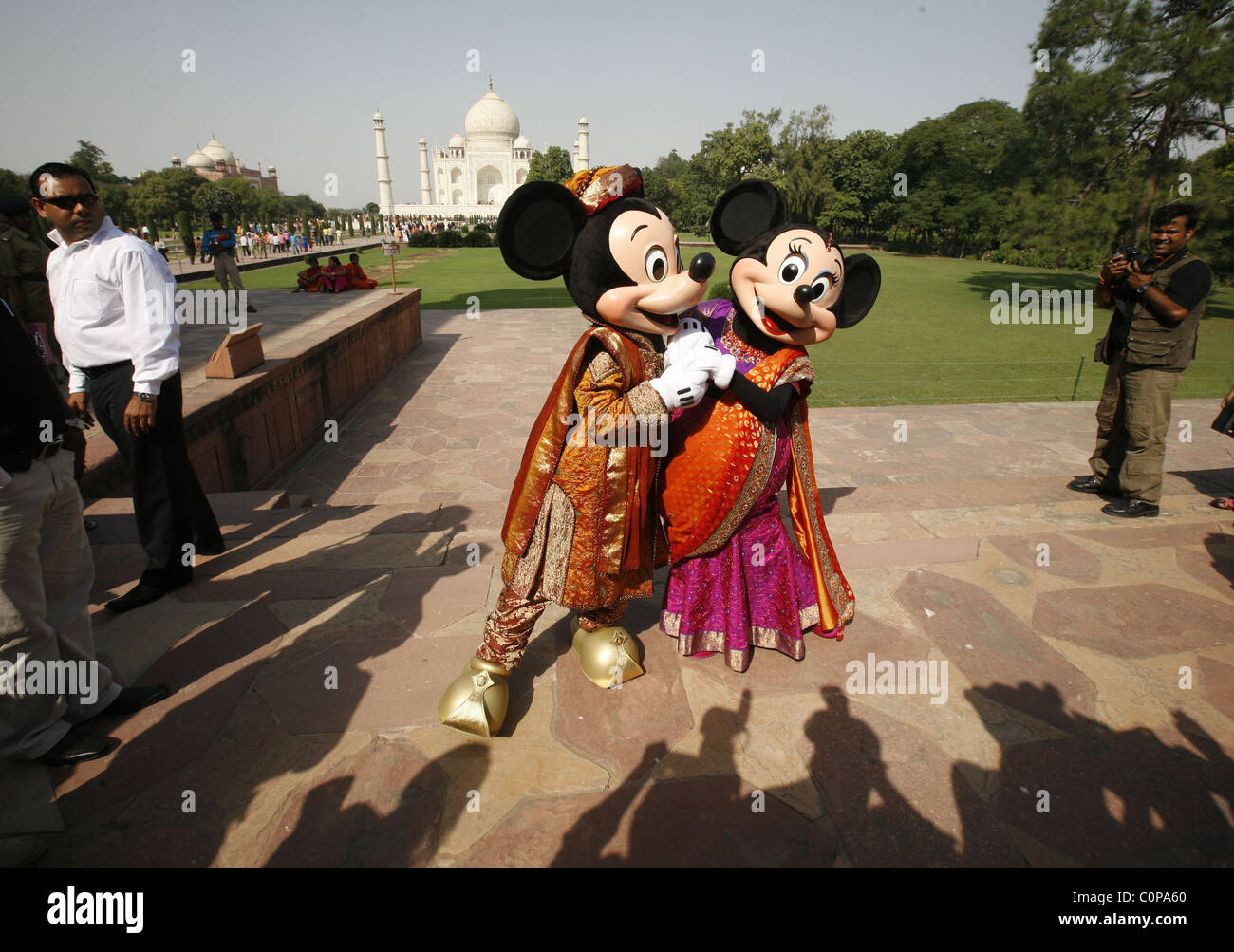 Mickey Mouse and Minnie Mouse pose at the Taj Mahal in Agra, India. The ...