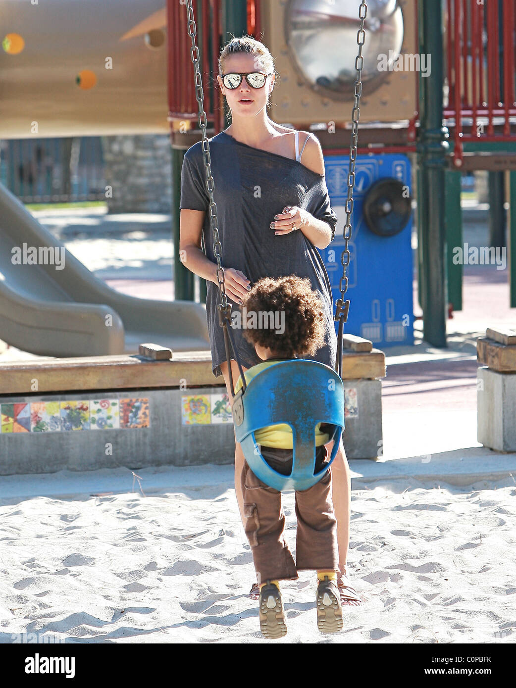 Heidi Klum pushes her son Johan on a swing Heidi Klum spends the day ...