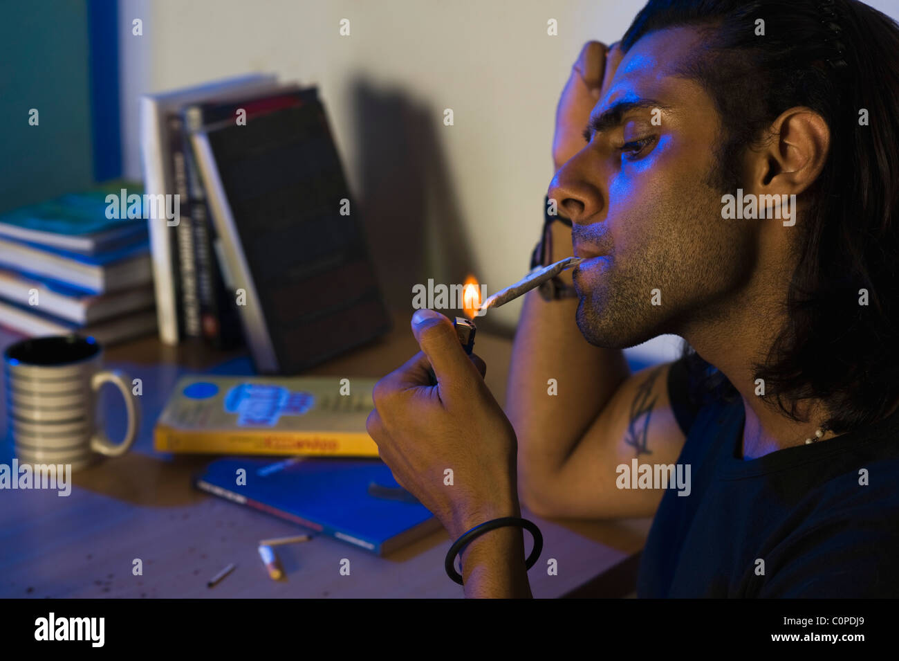 Close-up of a man smoking drugs Stock Photo - Alamy