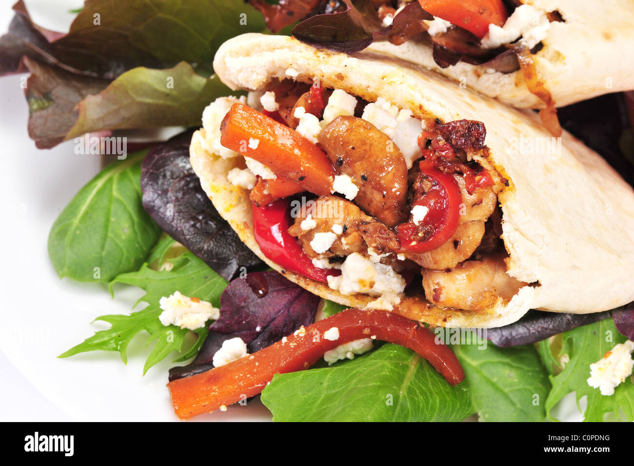 Pitta bread on salad leaves filled with a chiсken Stock Photo - Alamy