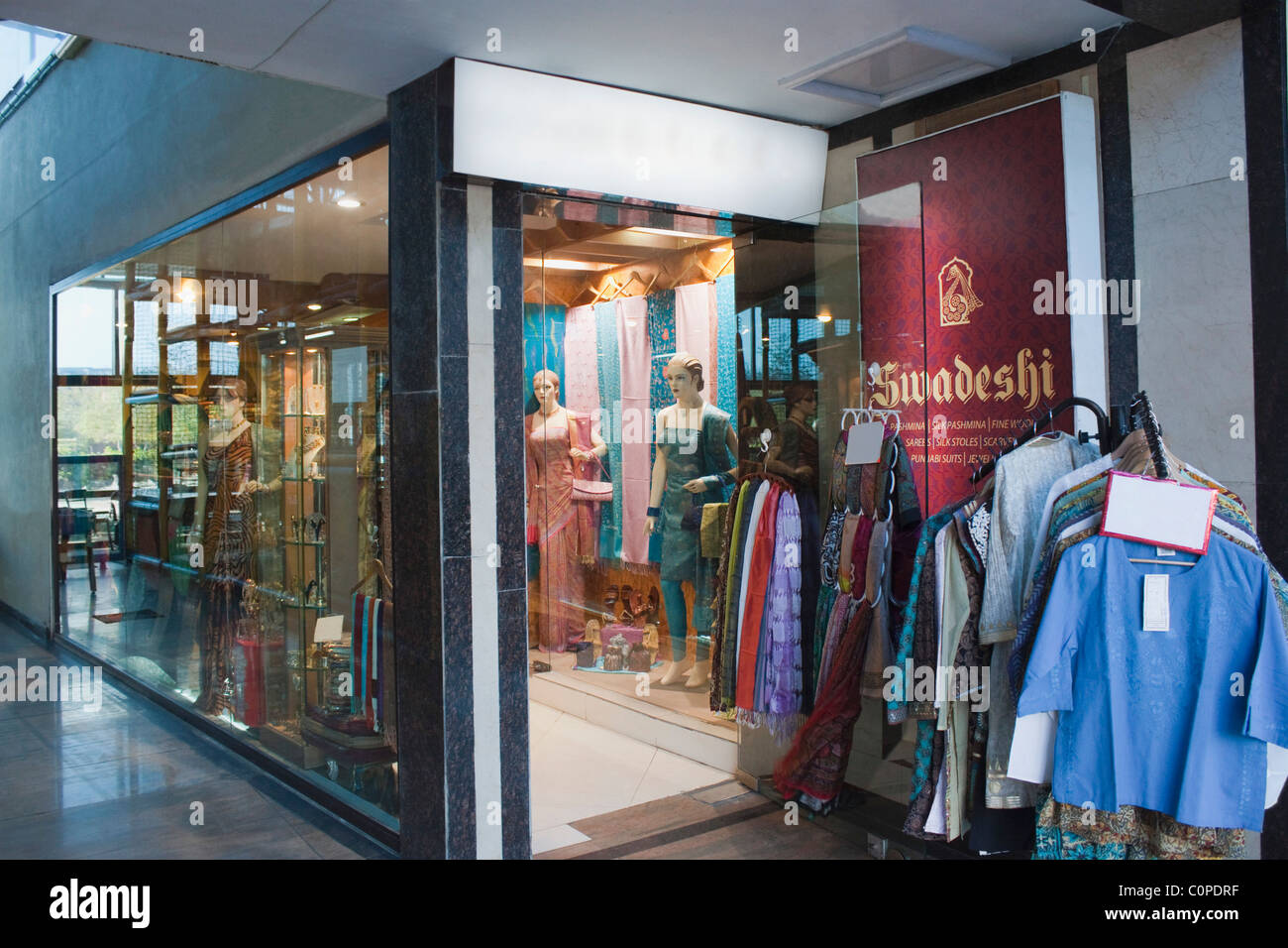 Clothes hanging in a clothing store, Ansal Plaza, New Delhi, India ...