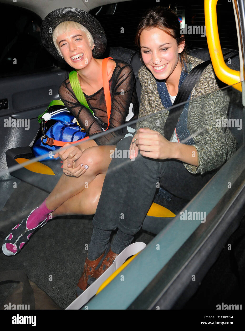 Agyness Deyn and Alexa Chung play up to the cameras, as they leave the ...
