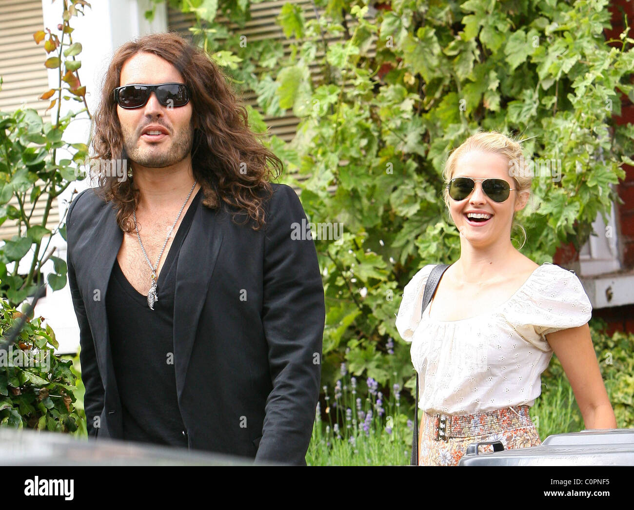 Russell Brand and his girlfriend Teresa Palmer arrive back home after a ...
