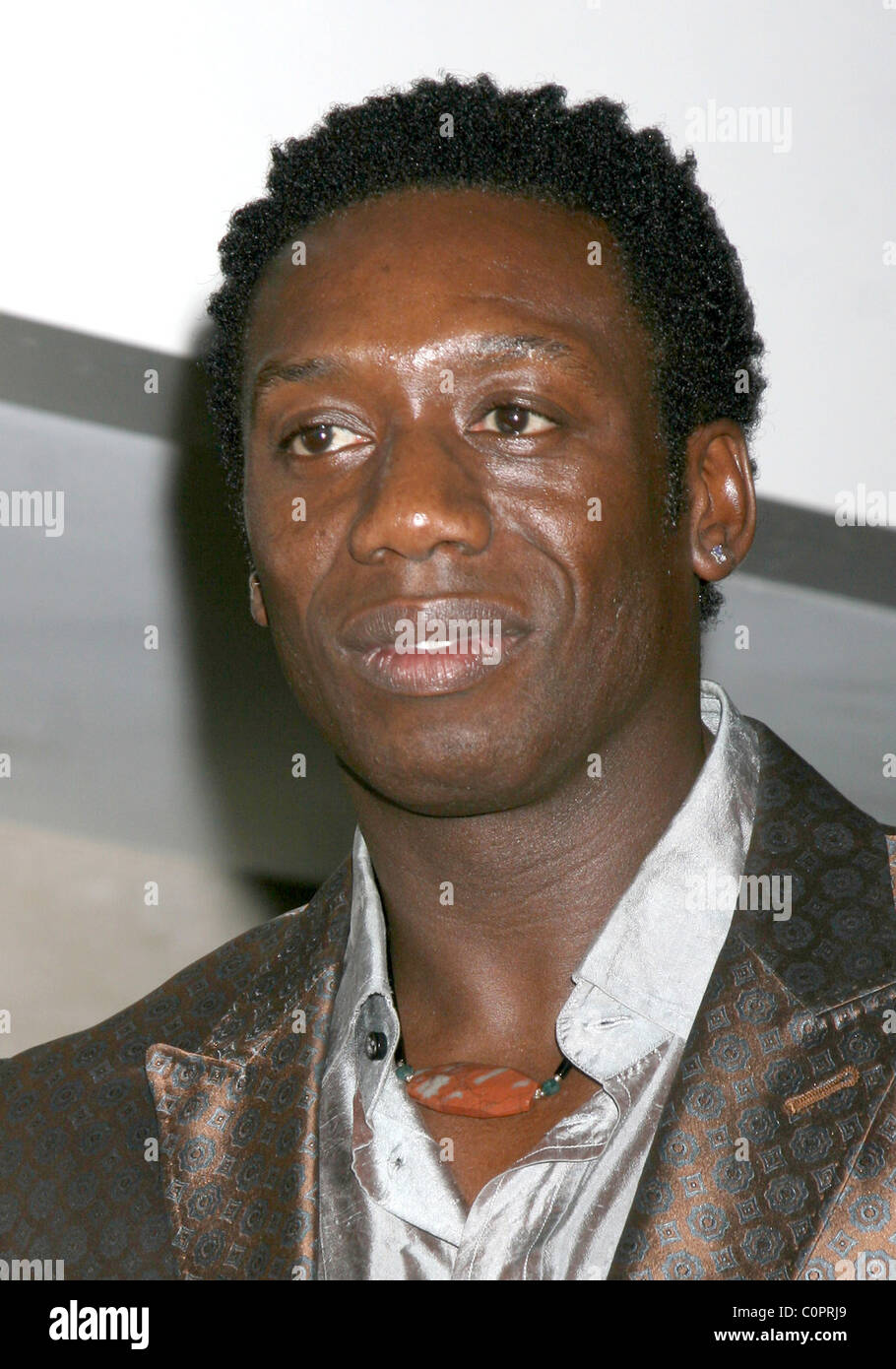 Hakeem Kae-Kazim arriving at a photo exhibit featuring pictures taken ...