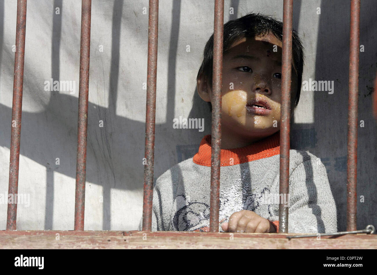 BOY KEPT PRISONER BY PARENTS A five-year-old boy screams with ...