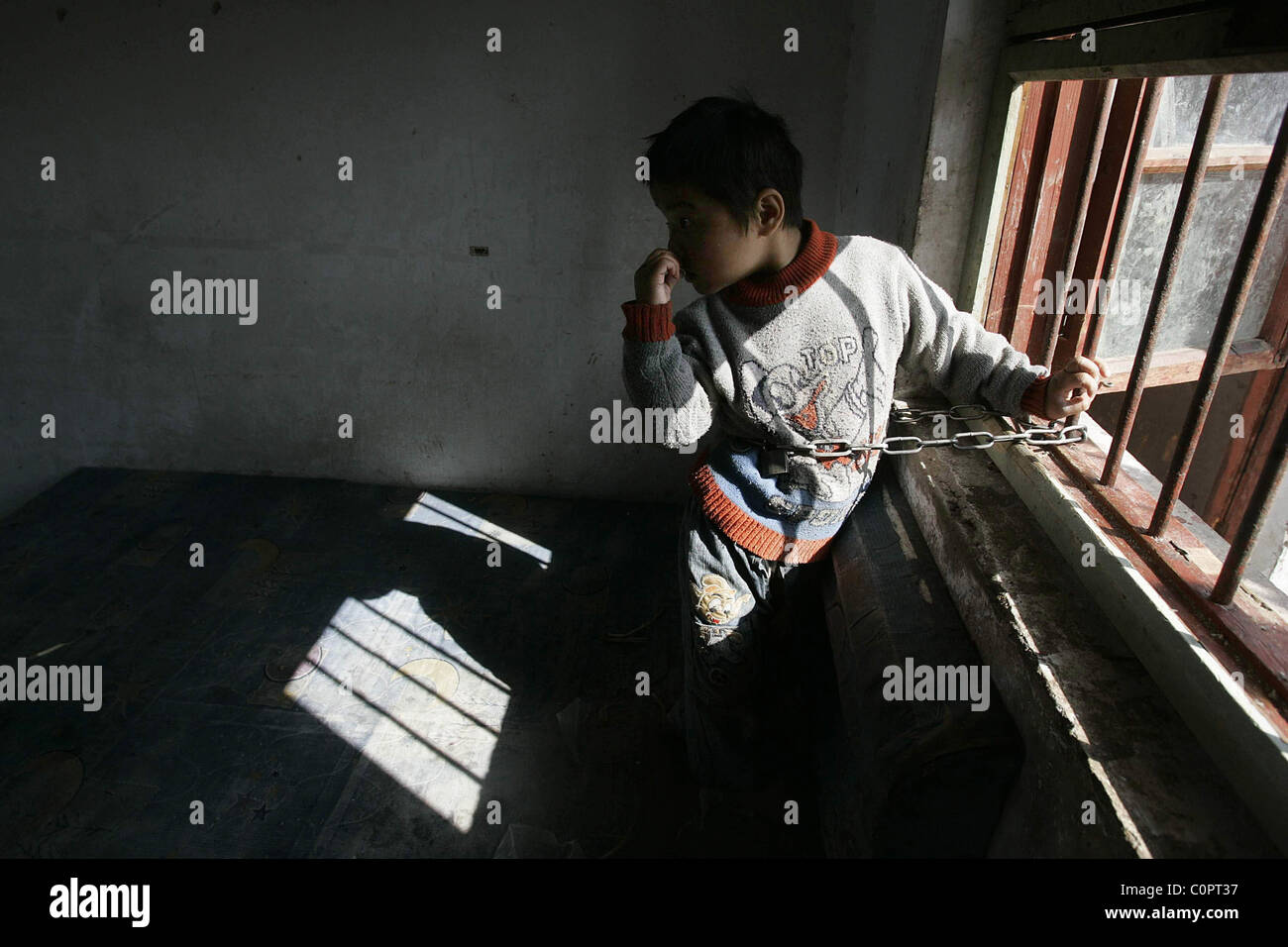 BOY KEPT PRISONER BY PARENTS A five-year-old boy screams with ...