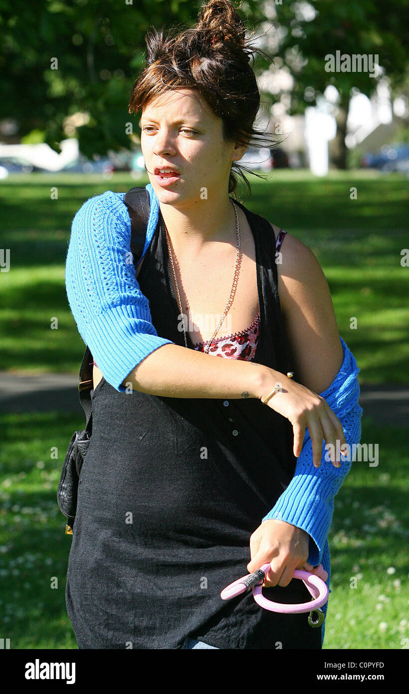 Lily Allen shows her bra as she takes her new dog Mable for a walk on ...