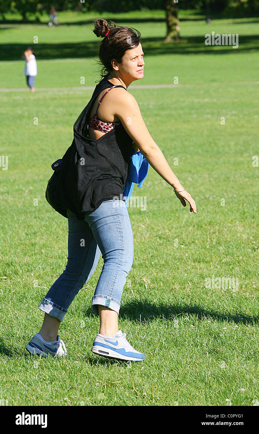 Lily Allen shows her bra as she takes her new dog Mable for a walk on ...