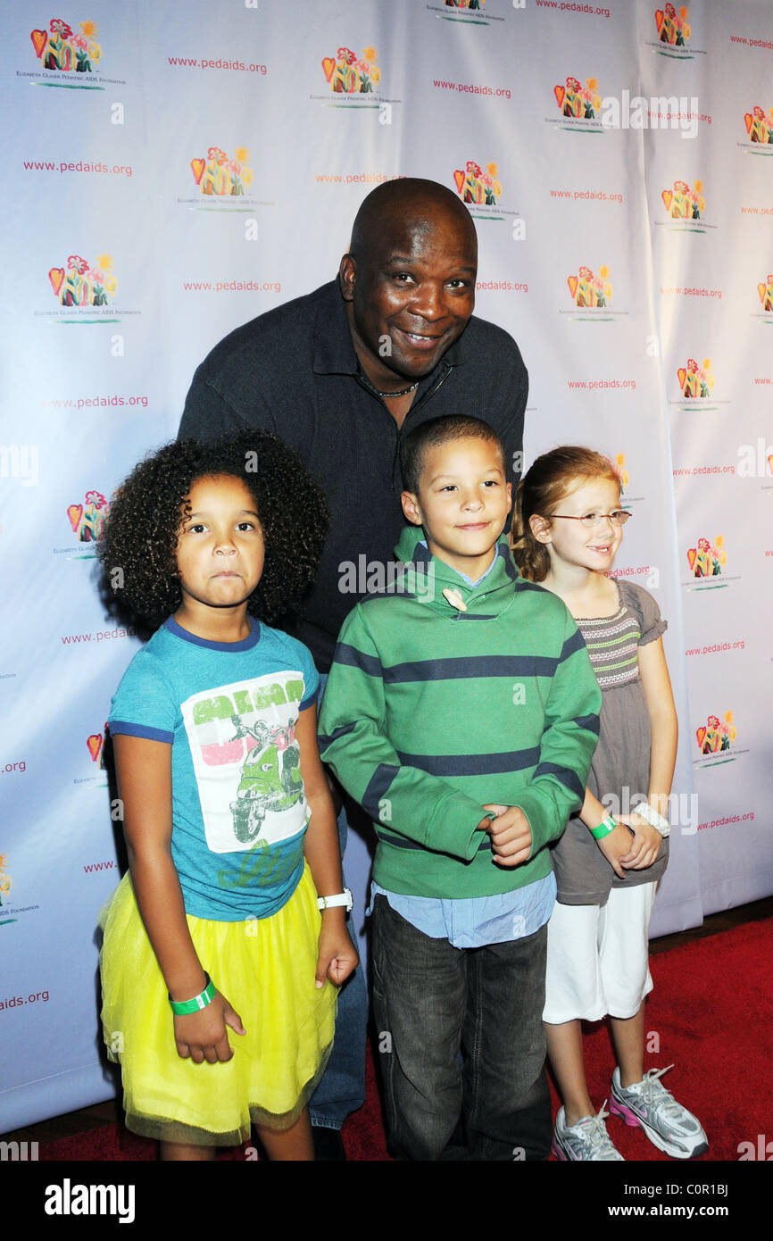 Howard Cross and family attending the 'Kids For Kids Carnival' to ...