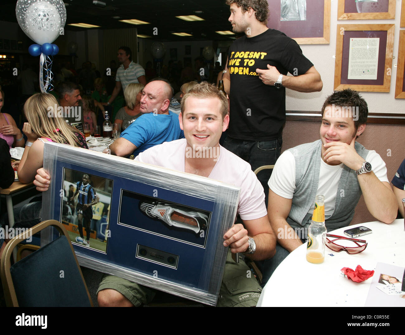 Danny Young and friend pay £350 for a signed boot in the charity ...