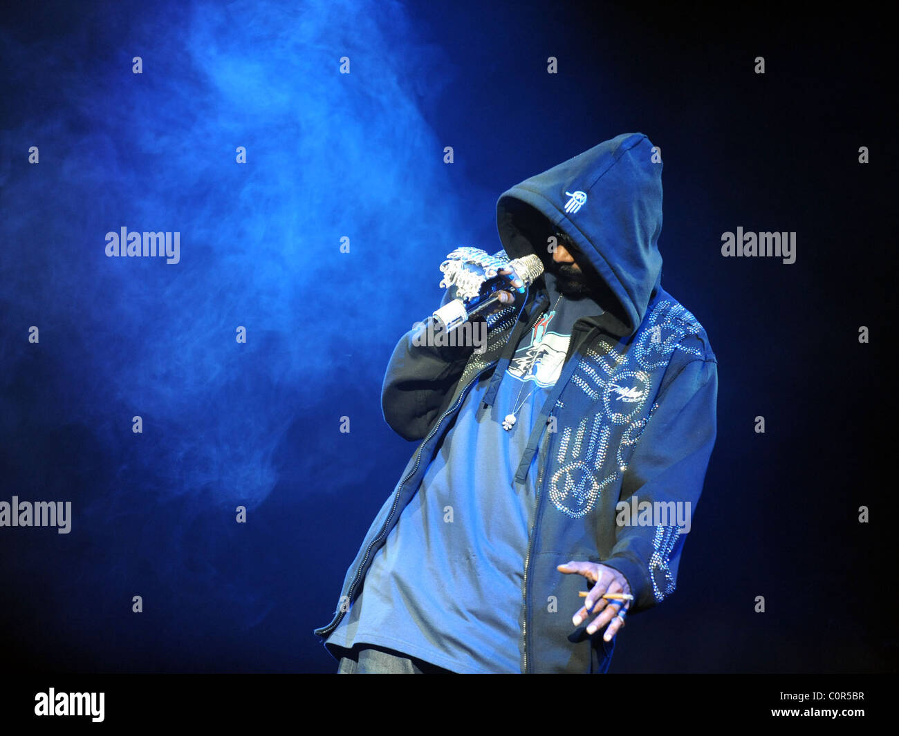American rapper Snoop Dogg smoking on stage while performing in concert ...