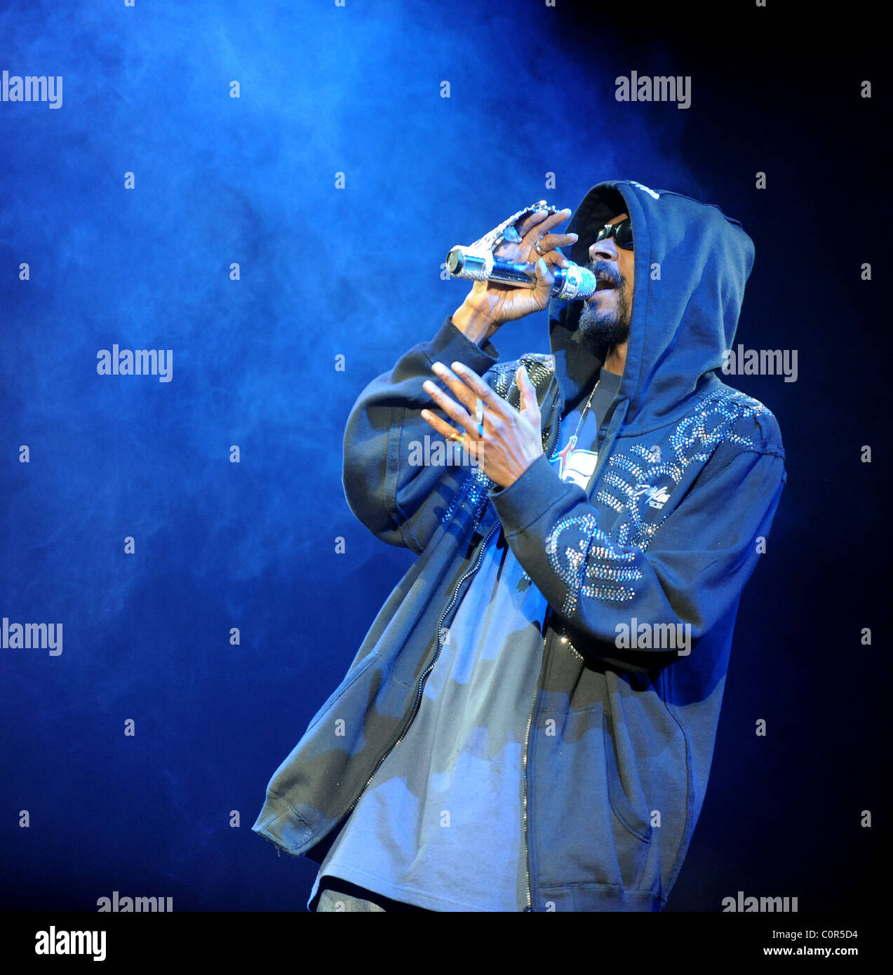 American rapper Snoop Dogg smoking on stage while performing in concert ...