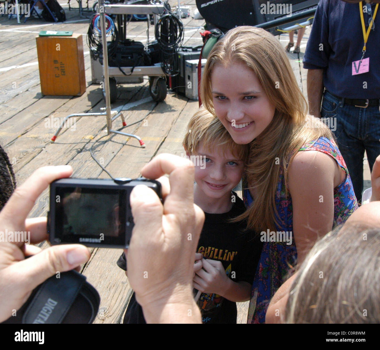 Emily Osment Signs autographs on the set of 'Hannah Montana: The Movie ...