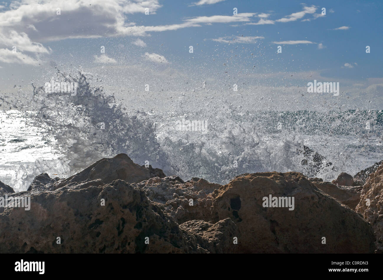 Waves breaking over the rocks and beach at Paphos in Cyprus Stock Photo ...