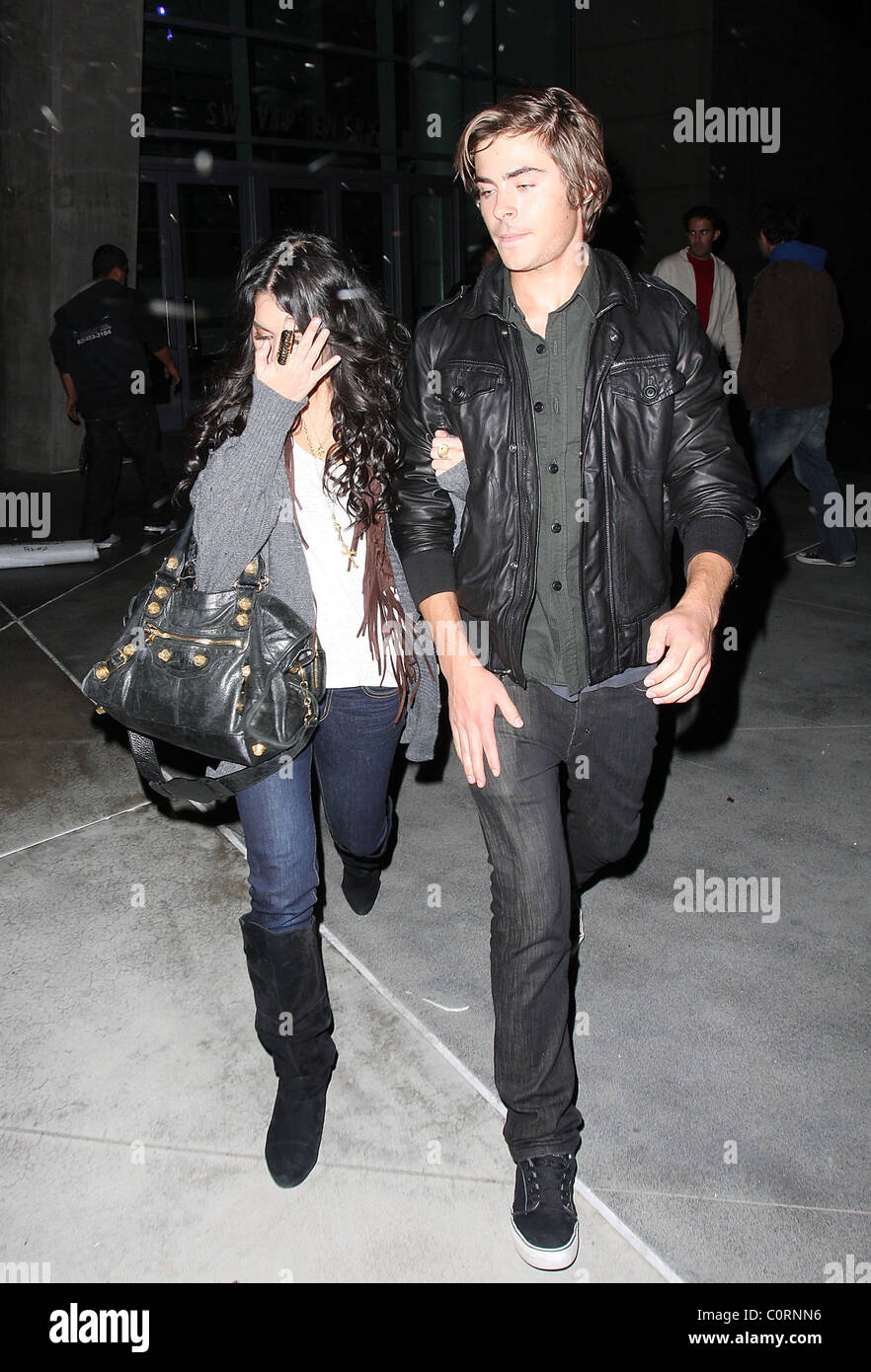 Zac Efron and Vanessa Hudgens leaving a Lakers game at the Staples ...