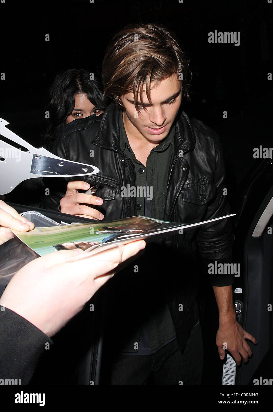 Vanessa Hudgens and Zac Efron leaving a Lakers game at the Staples ...