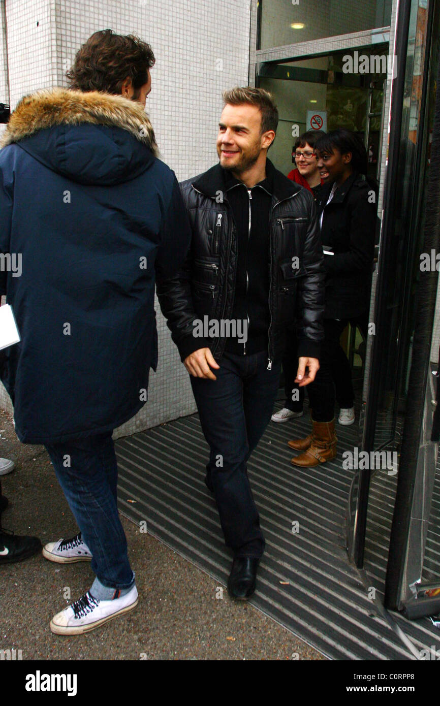 Howard Donald and Gary Barlow of Take That sign autographs for waiting ...