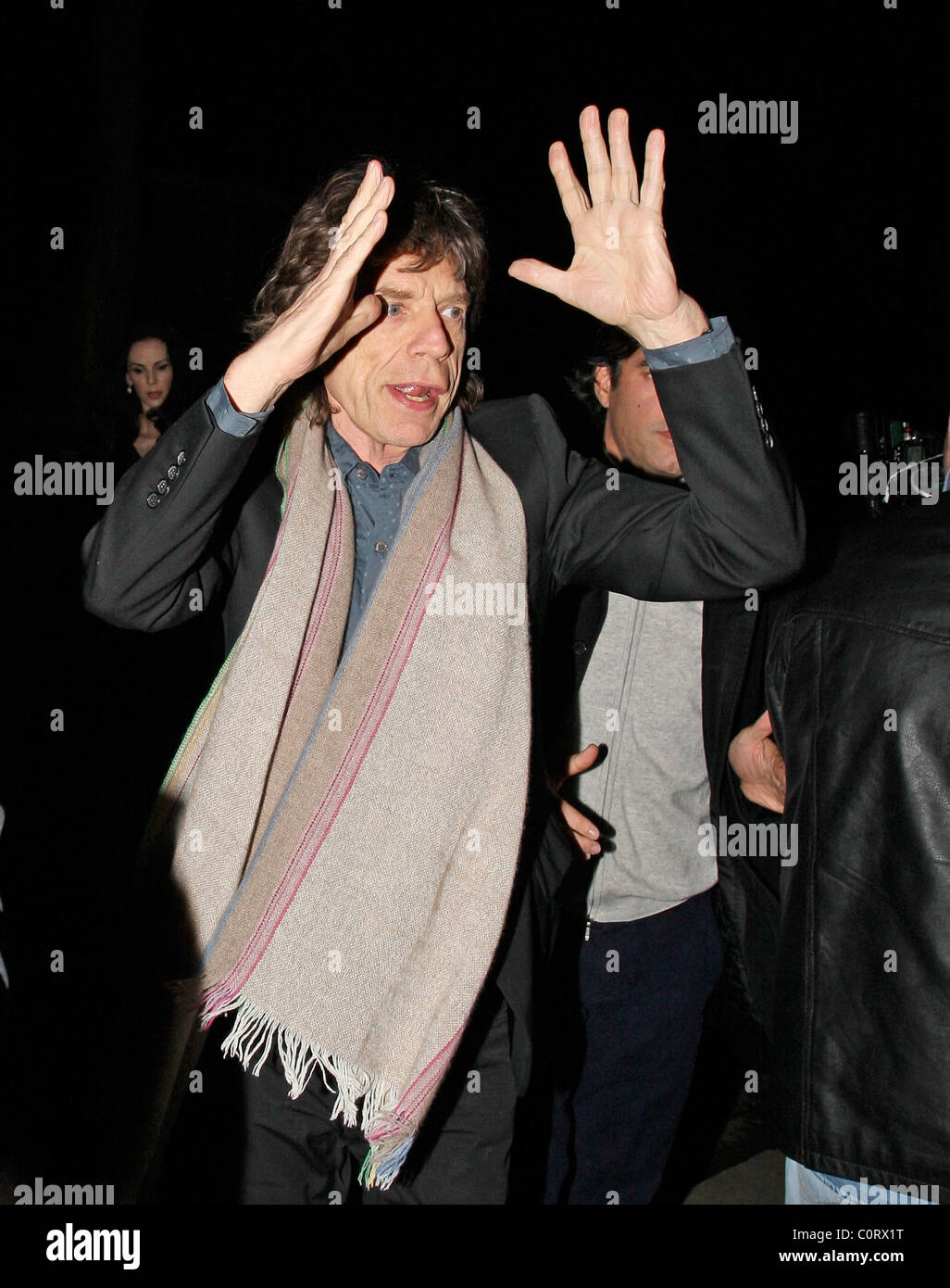 Mick Jagger waves his fists and karate chops as he fights his way ...