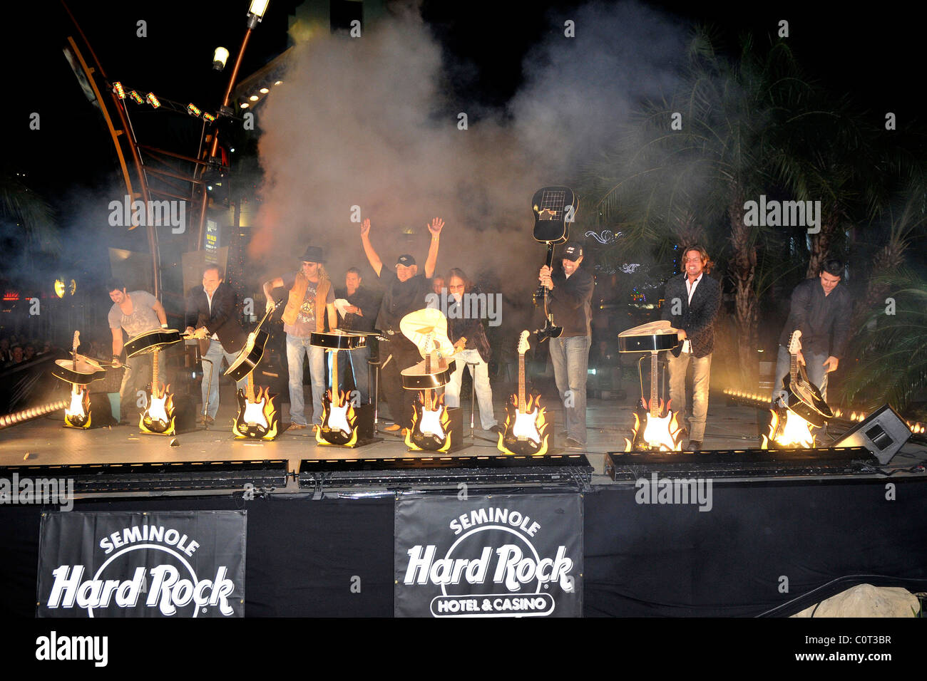 Stars of Music and Racing smash guitars to celebrate the grand opening ...