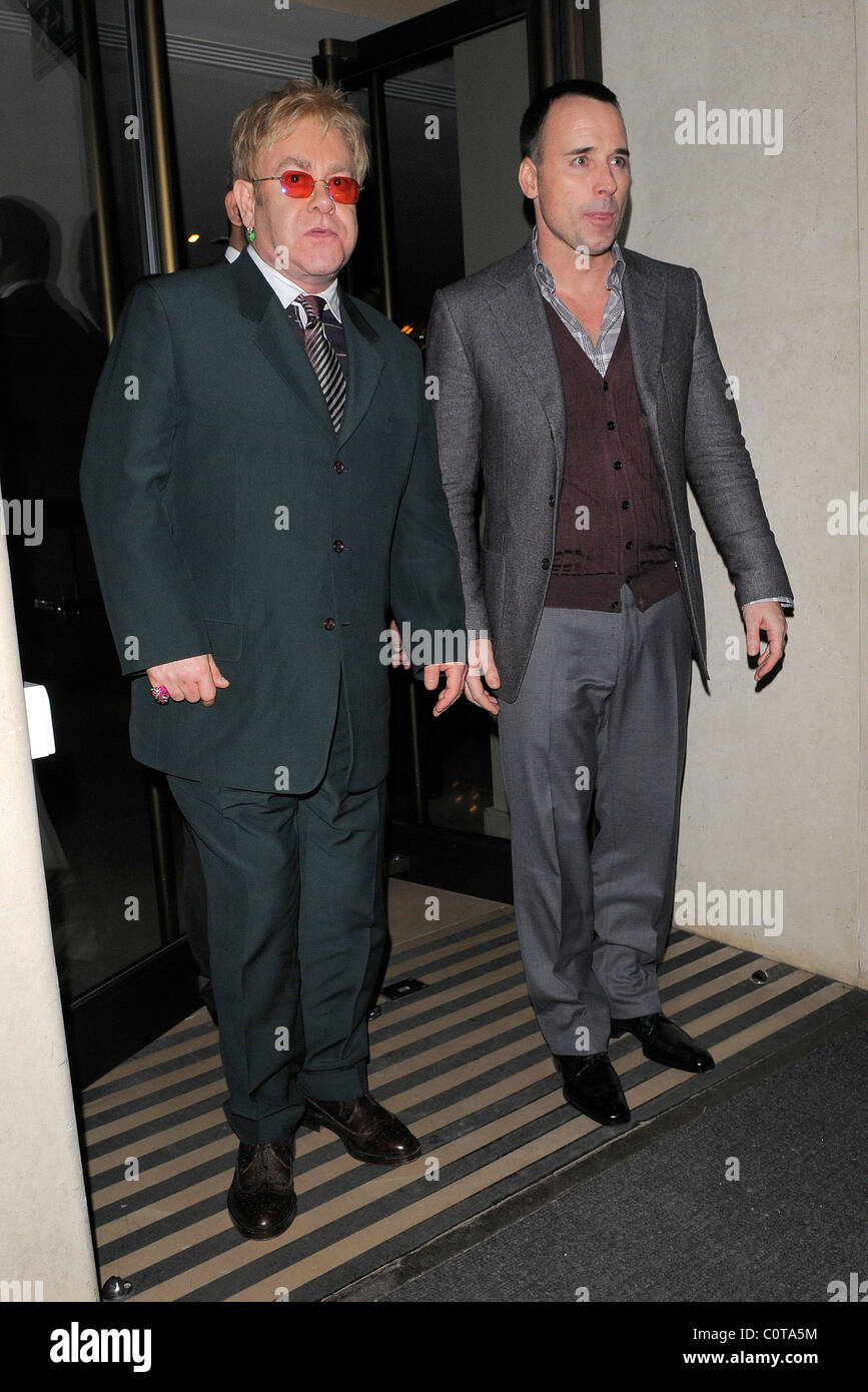 Sir Elton John and his partner David Furnish leaving the Mayfair Hotel ...