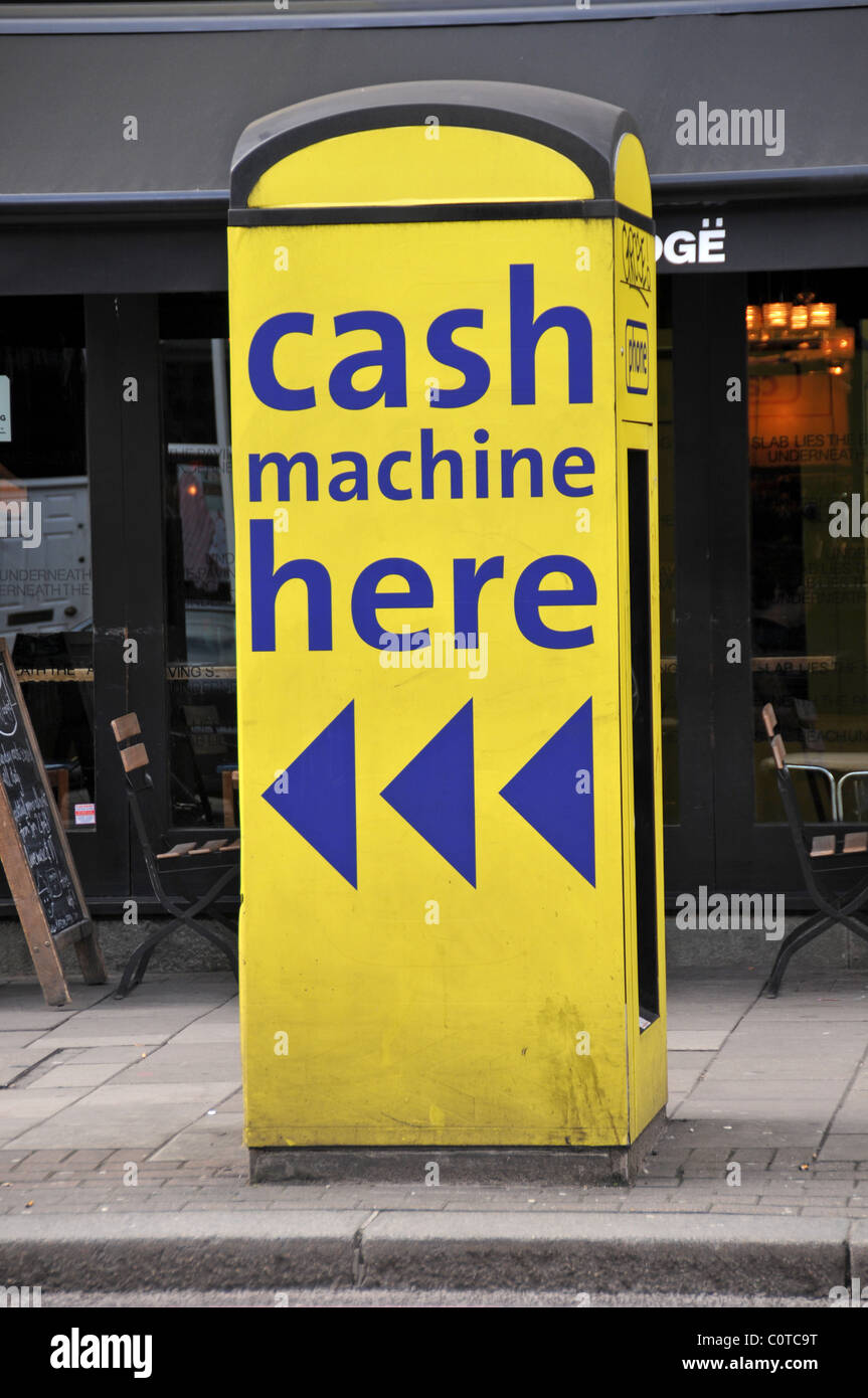Cash machine advert telephone box Stock Photo - Alamy