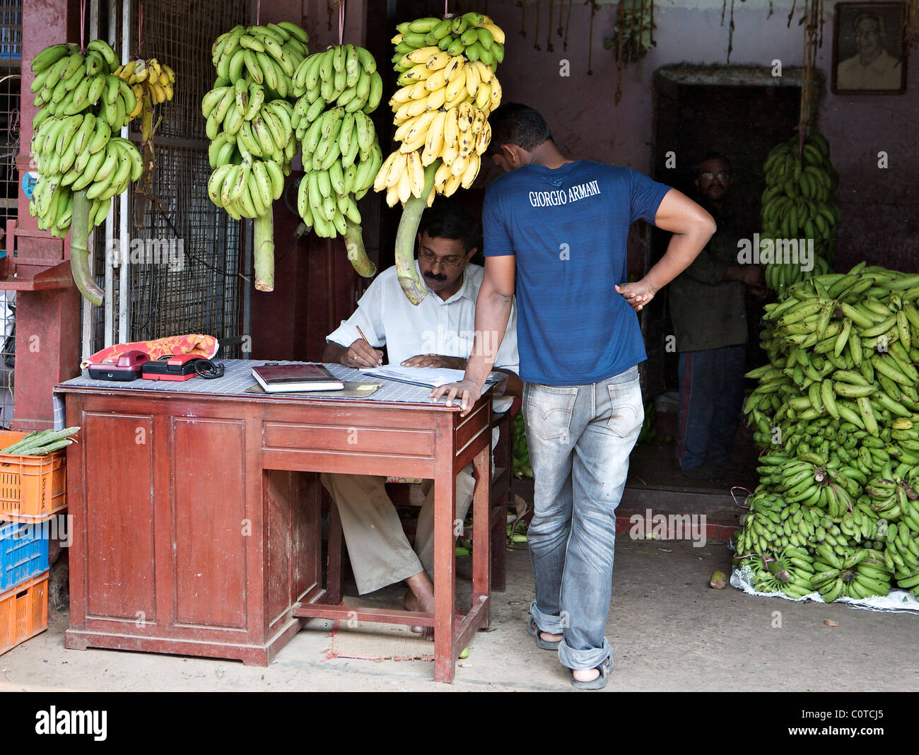 Banana trader Fort Cochin market, Kerala, India Stock Photo - Alamy