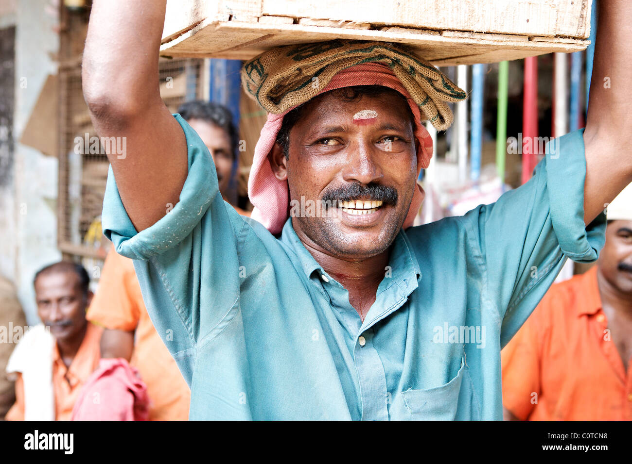 Porter in Fort Cochin market, Kerala, India Stock Photo - Alamy